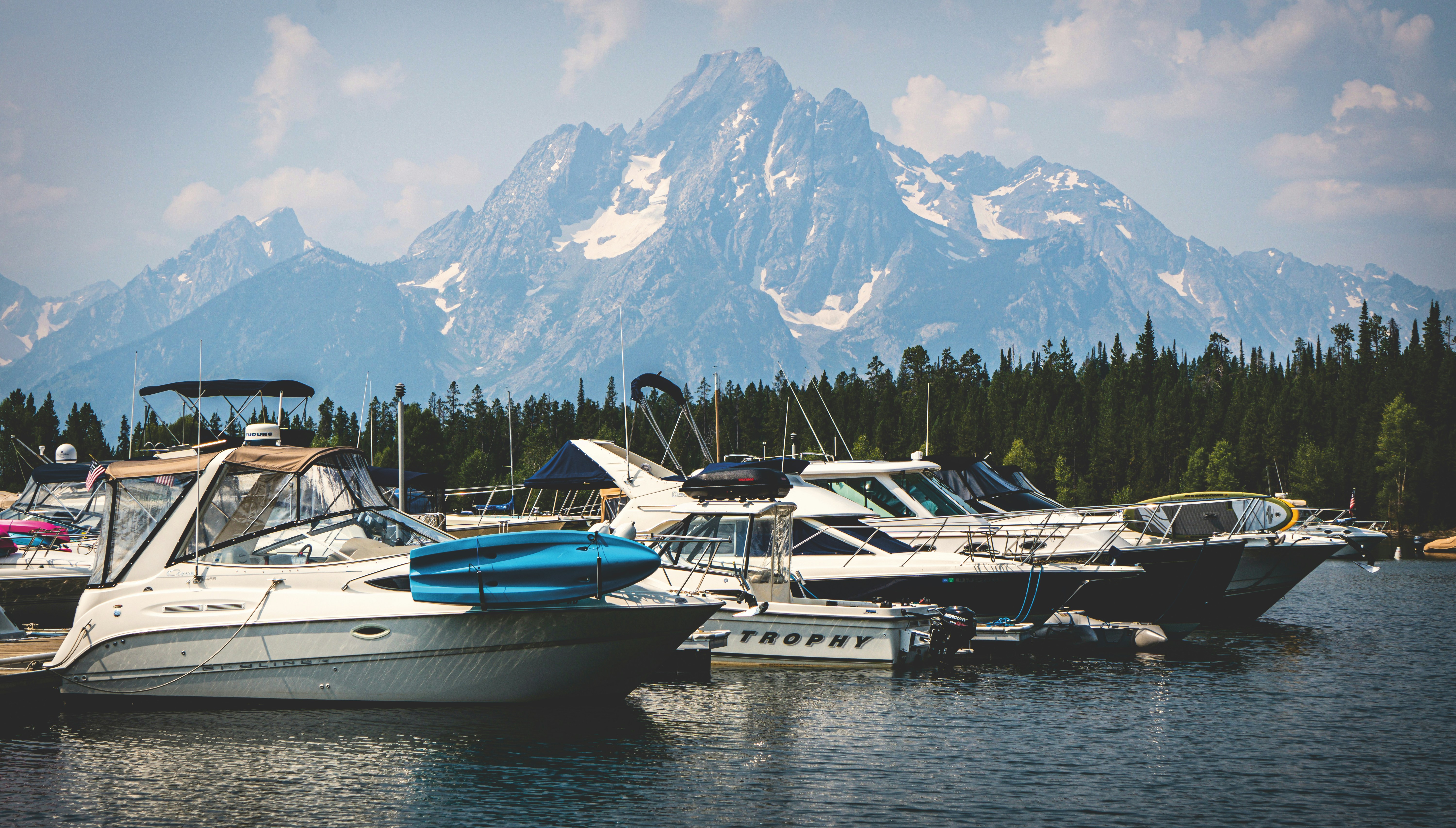 Marina in the Shadow of Alpine PeaksLucas