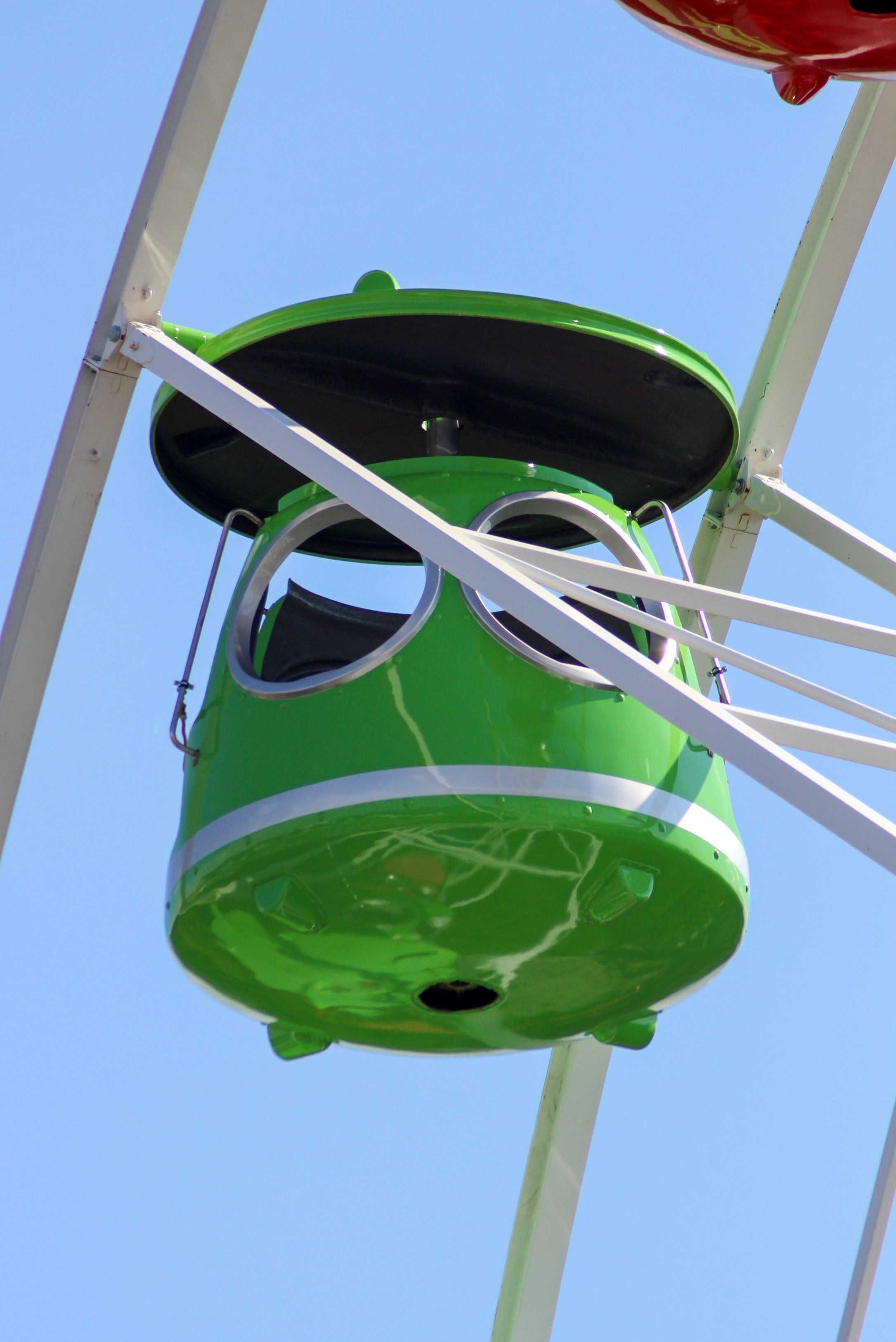 Lime Gondola in a Quiet Blue Canopy: Ferris Wheel Geometry