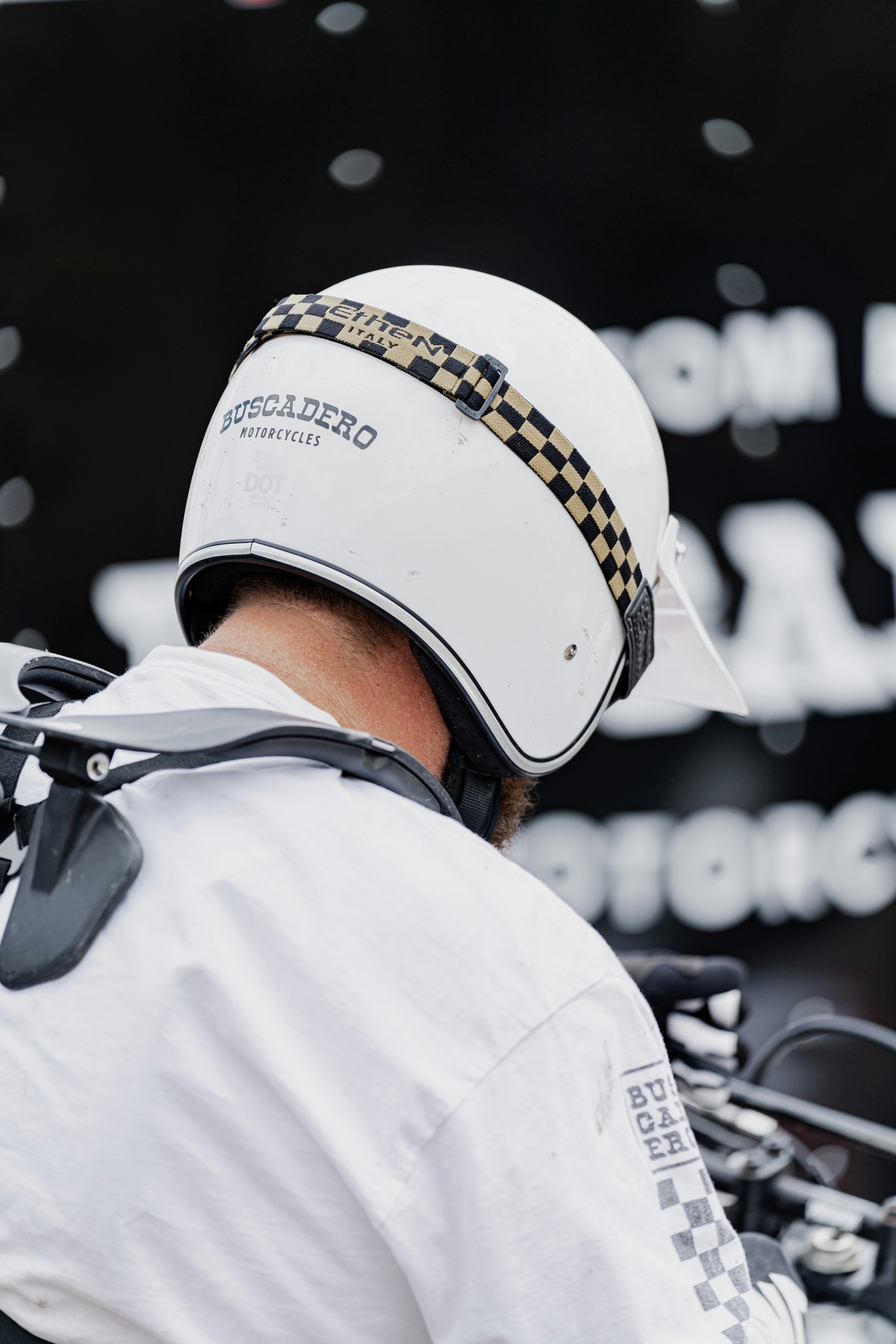 Helmeted Rider: a glimpse of grit and chrome at the edge of the frame
