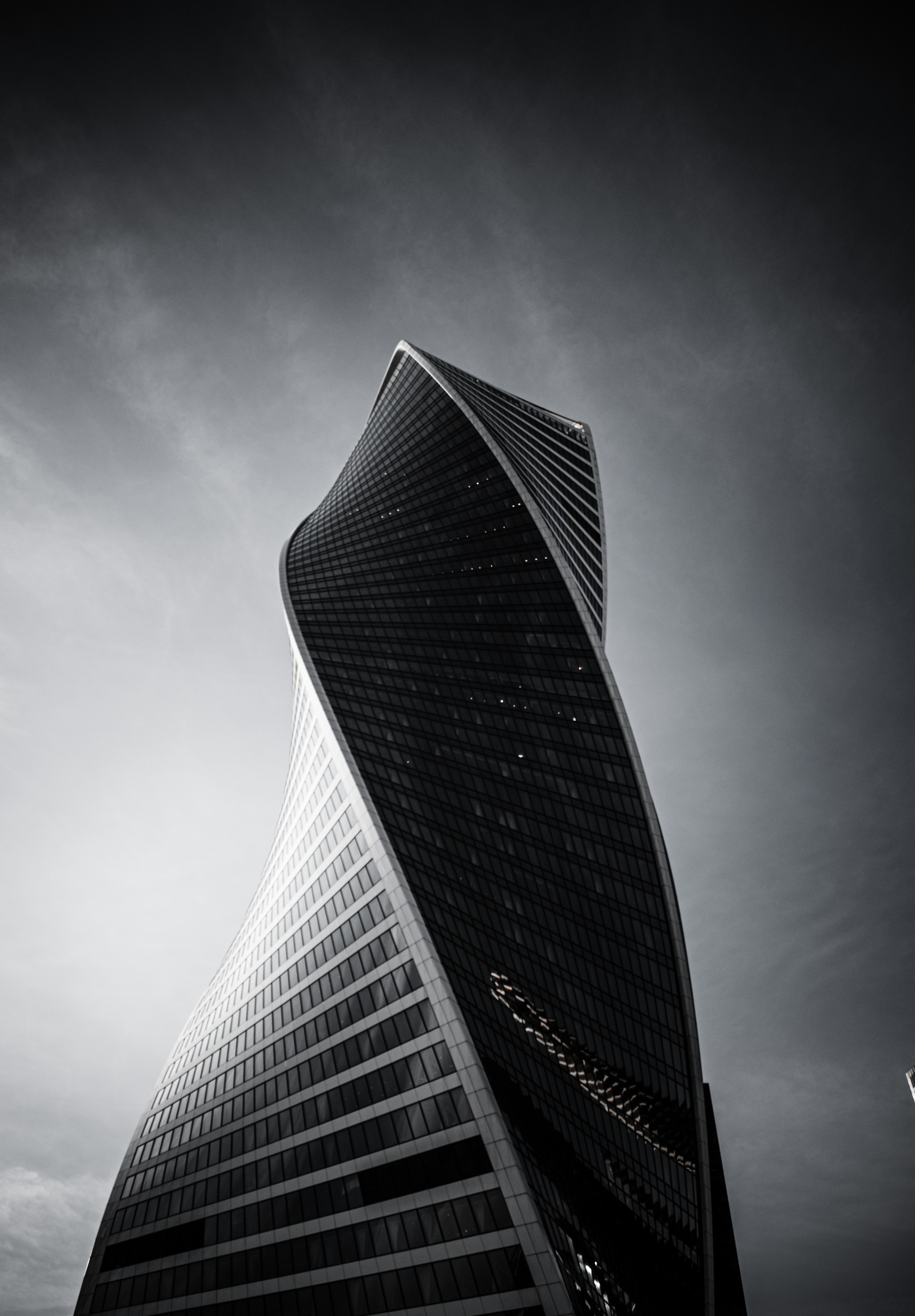 Skyscraper | black high rise building under gray sky