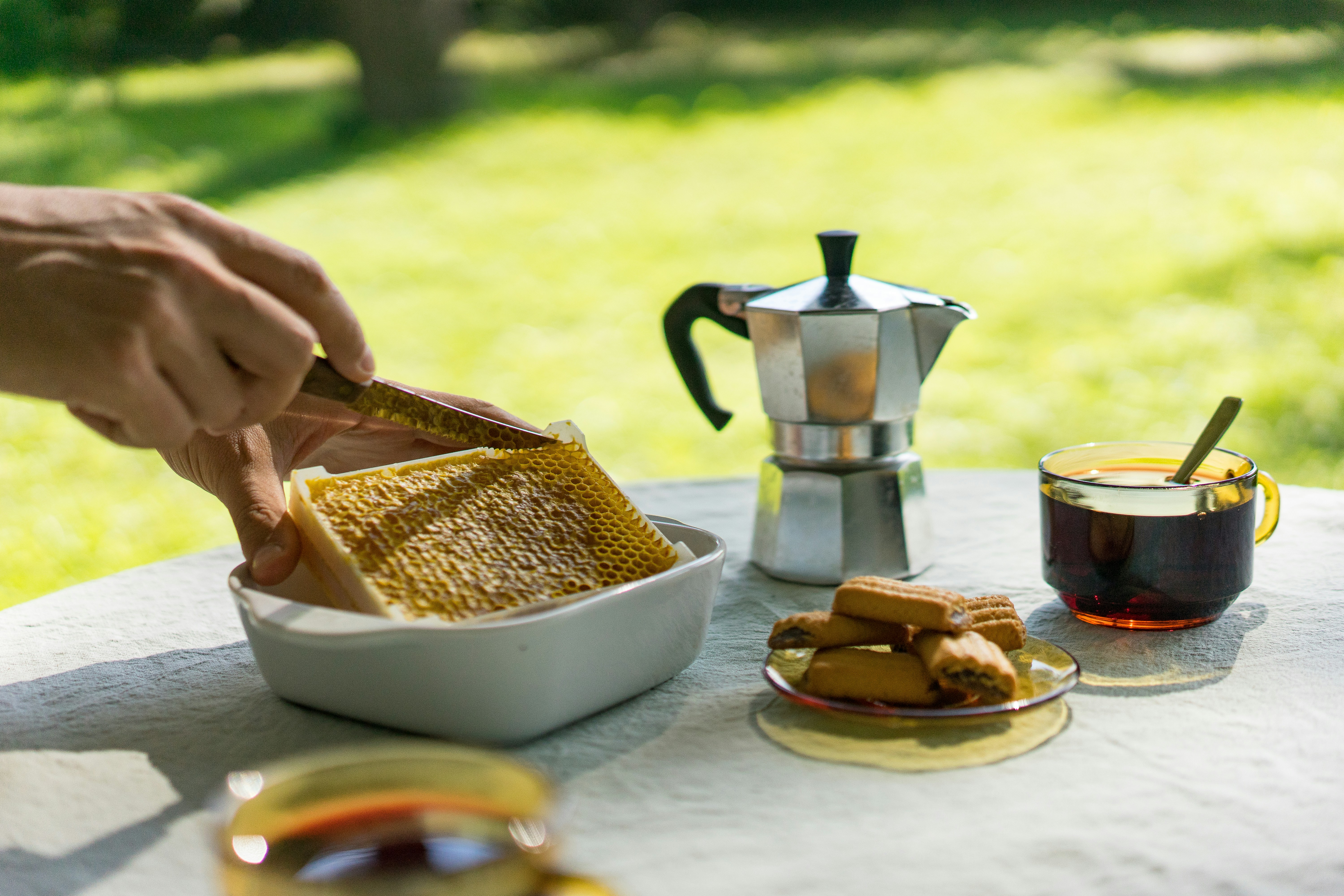 Honeycomb Moment: Sunlit Outdoor Breakfast Scene with Moka Pot