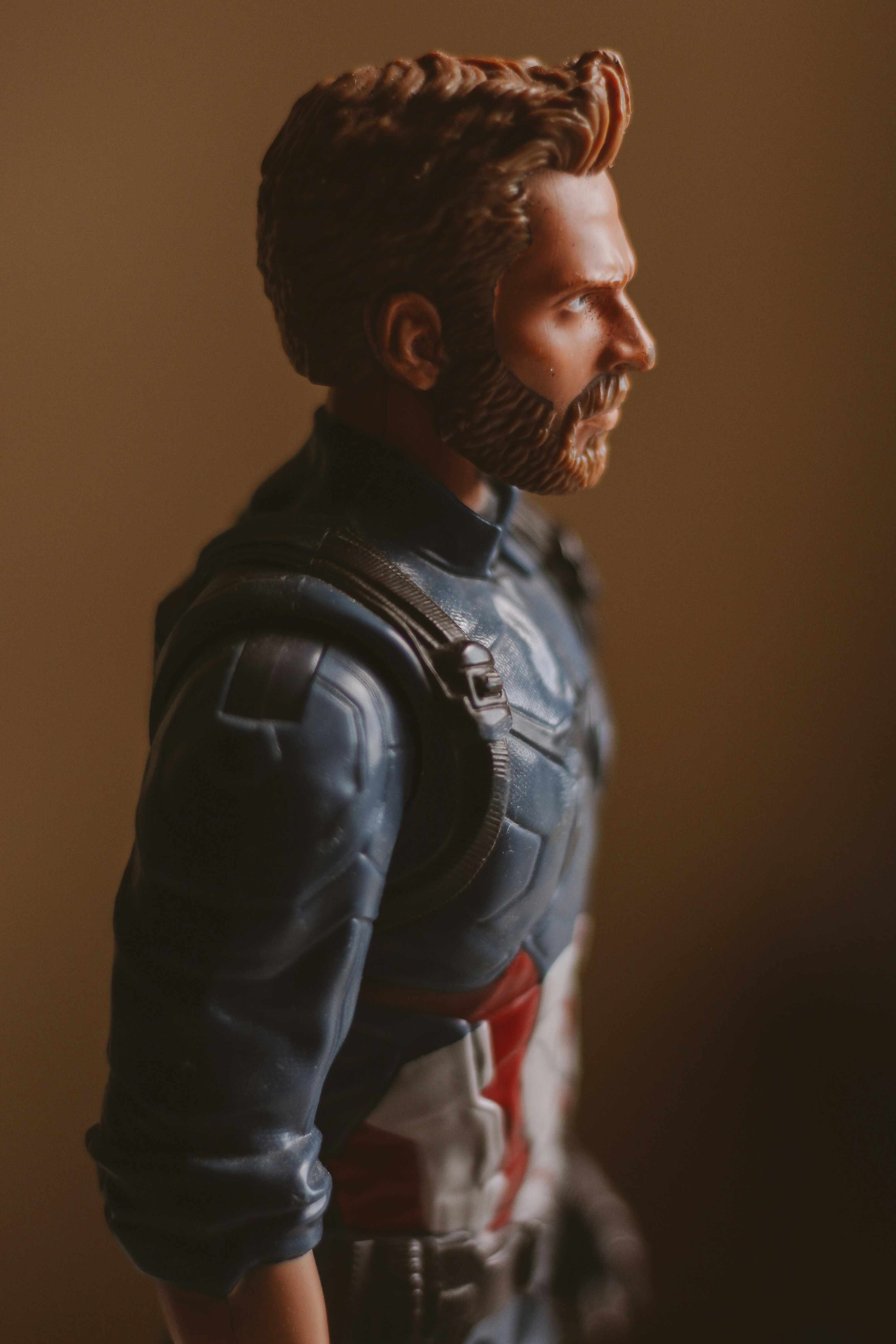 Amber-lit Profile: A Captain America Figurine in a Studio Portrait