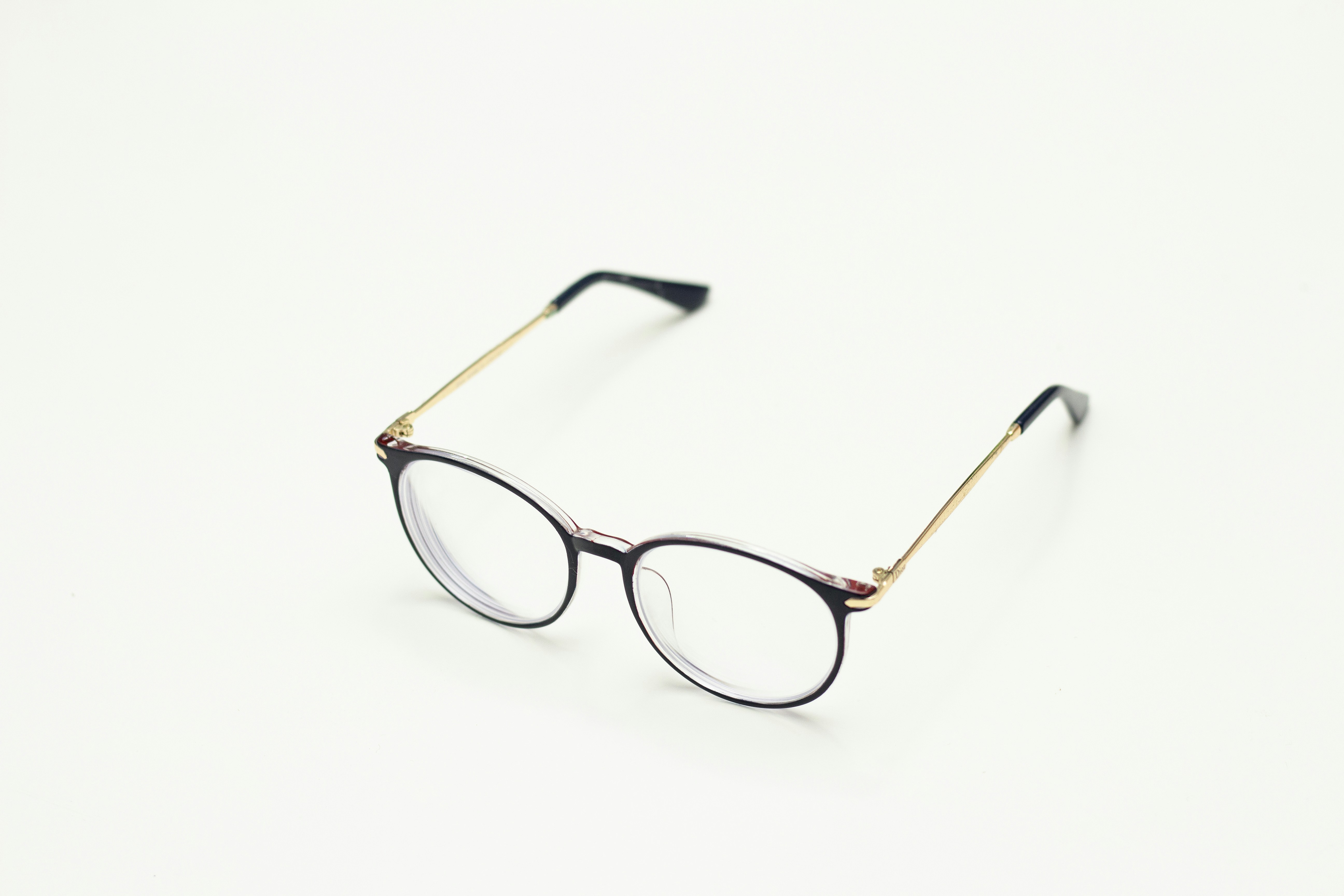 Glasses on white background | brown framed eyeglasses on white surface