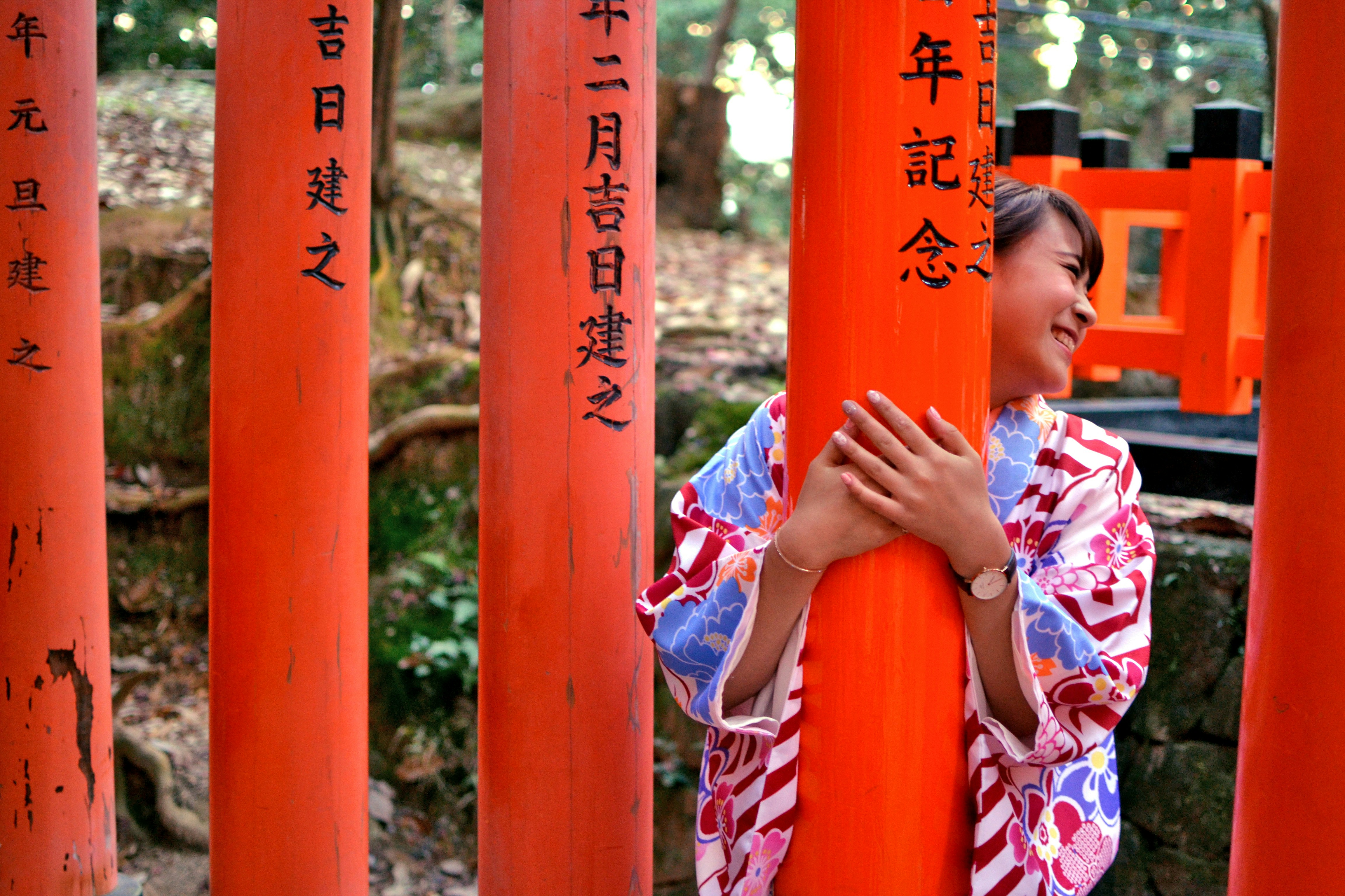 Hugging the Scarlet Columns: A Moment Among Torii