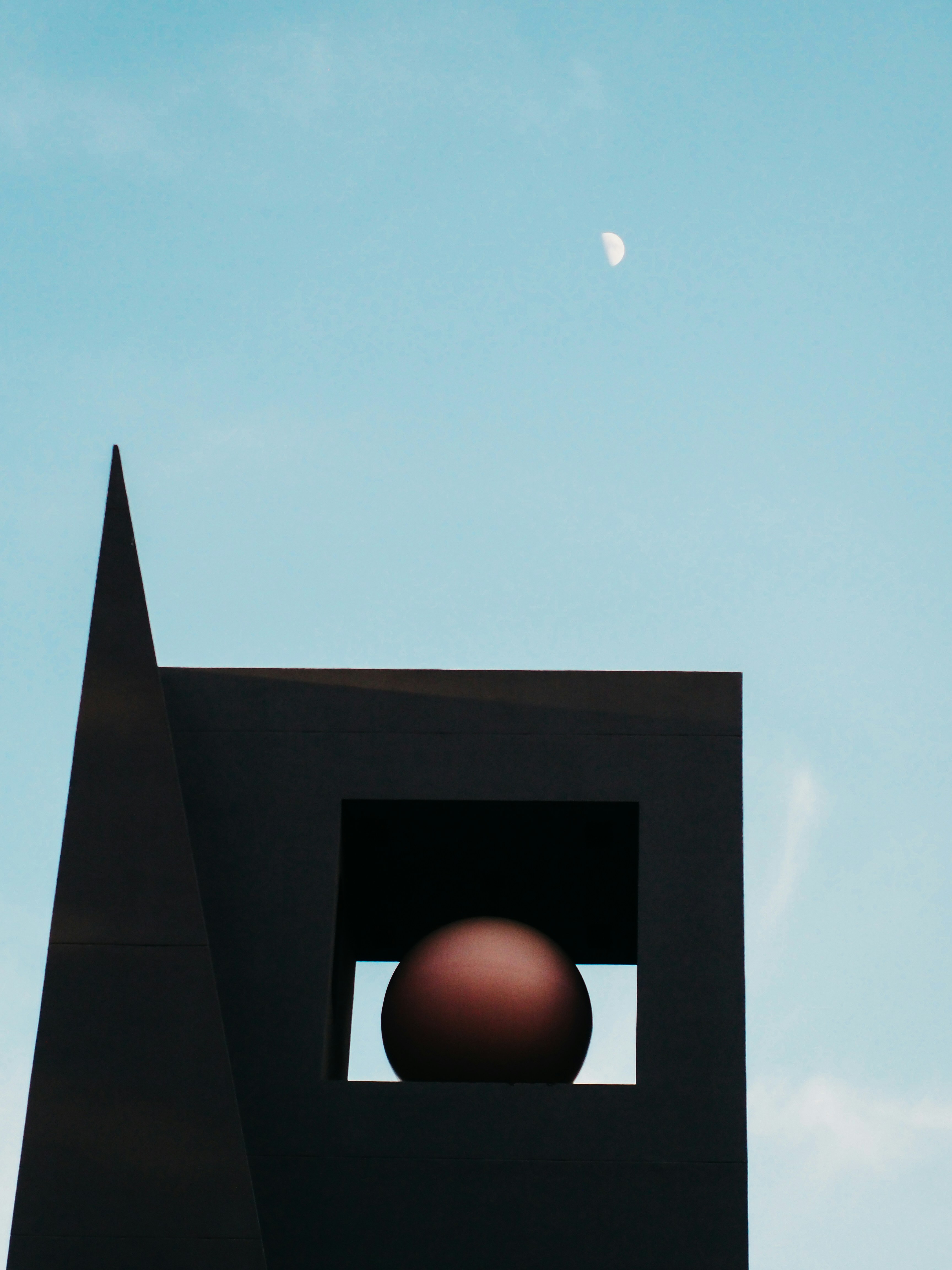 Red Sphere in a Square Frame Under Open Sky