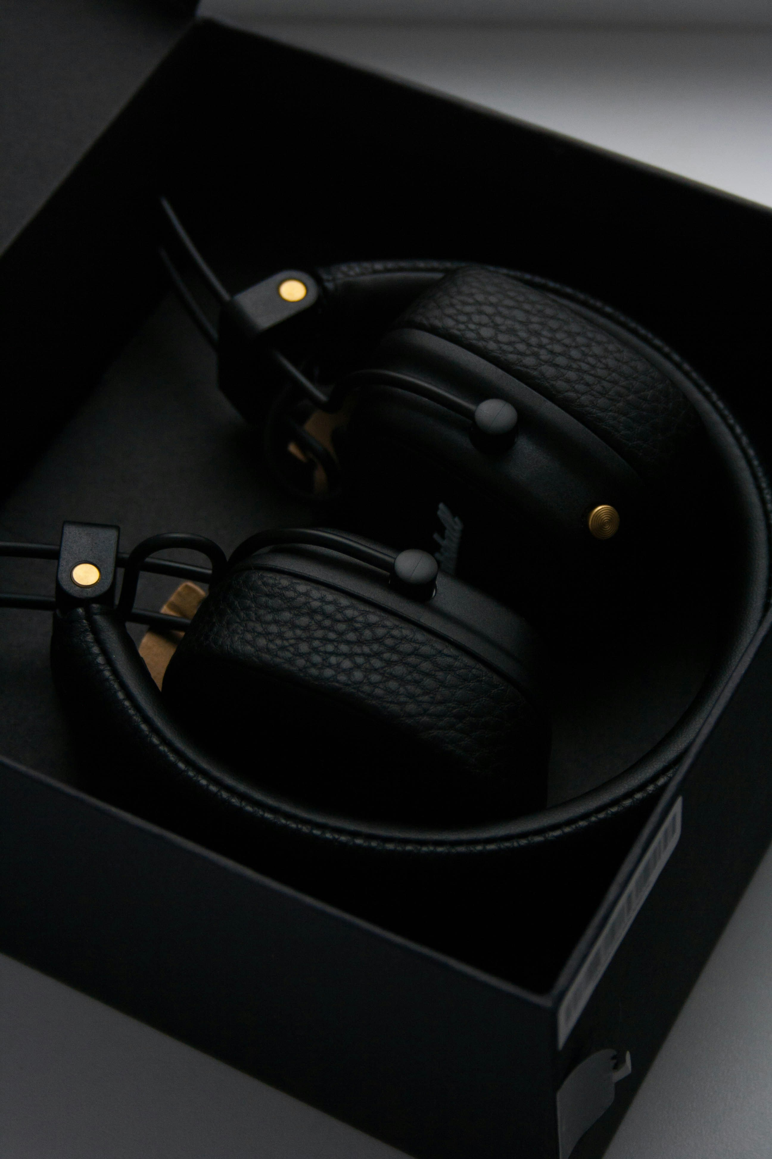 Shadowed Velvet Studio Headphones: Gold Accents in a Dark Box