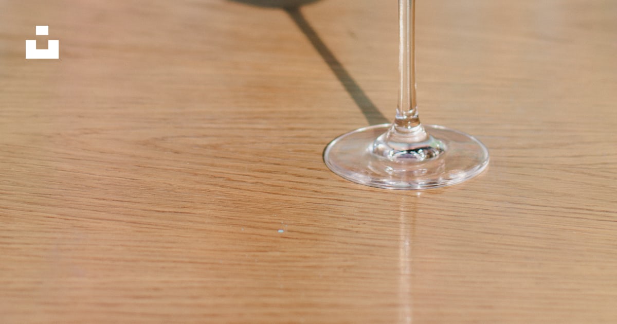 Clear Wine Glass With Red Liquid On Brown Wooden Table Photo Free Cocktail Image On Unsplash