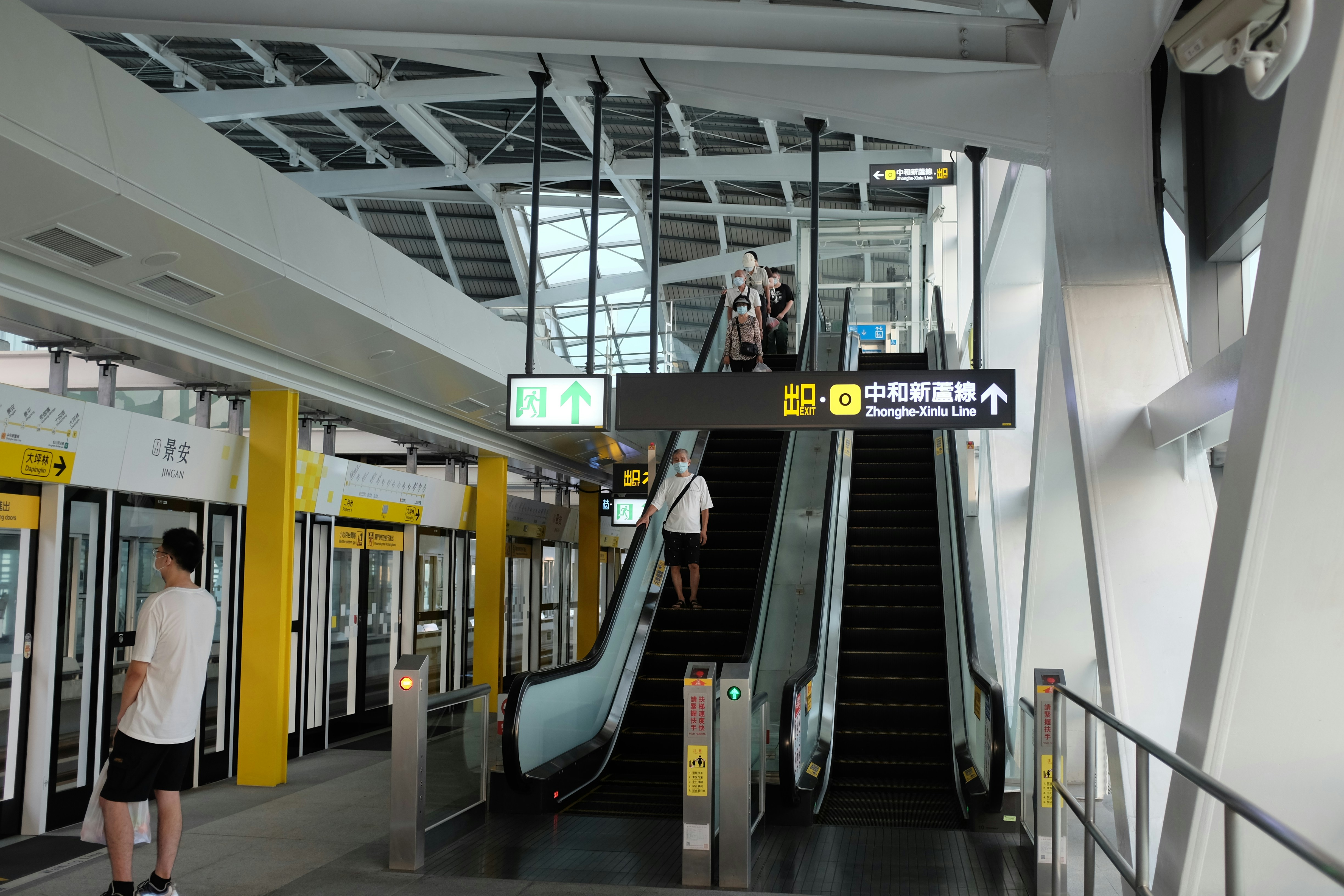 Yellow and black escalator inside building photo – Free Human Image on ...
