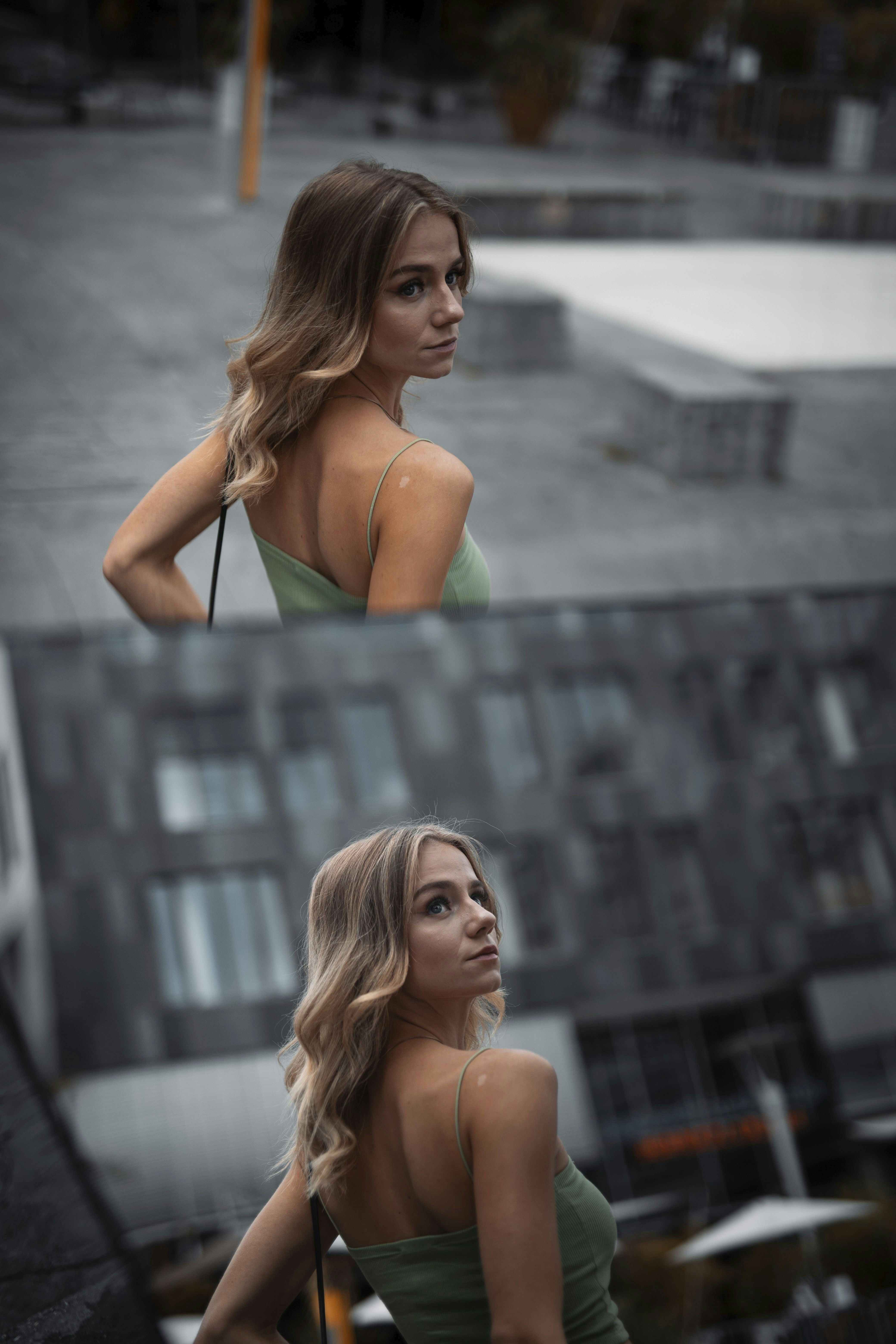 Urban Grace: Portrait Framed by Glass and Plaza