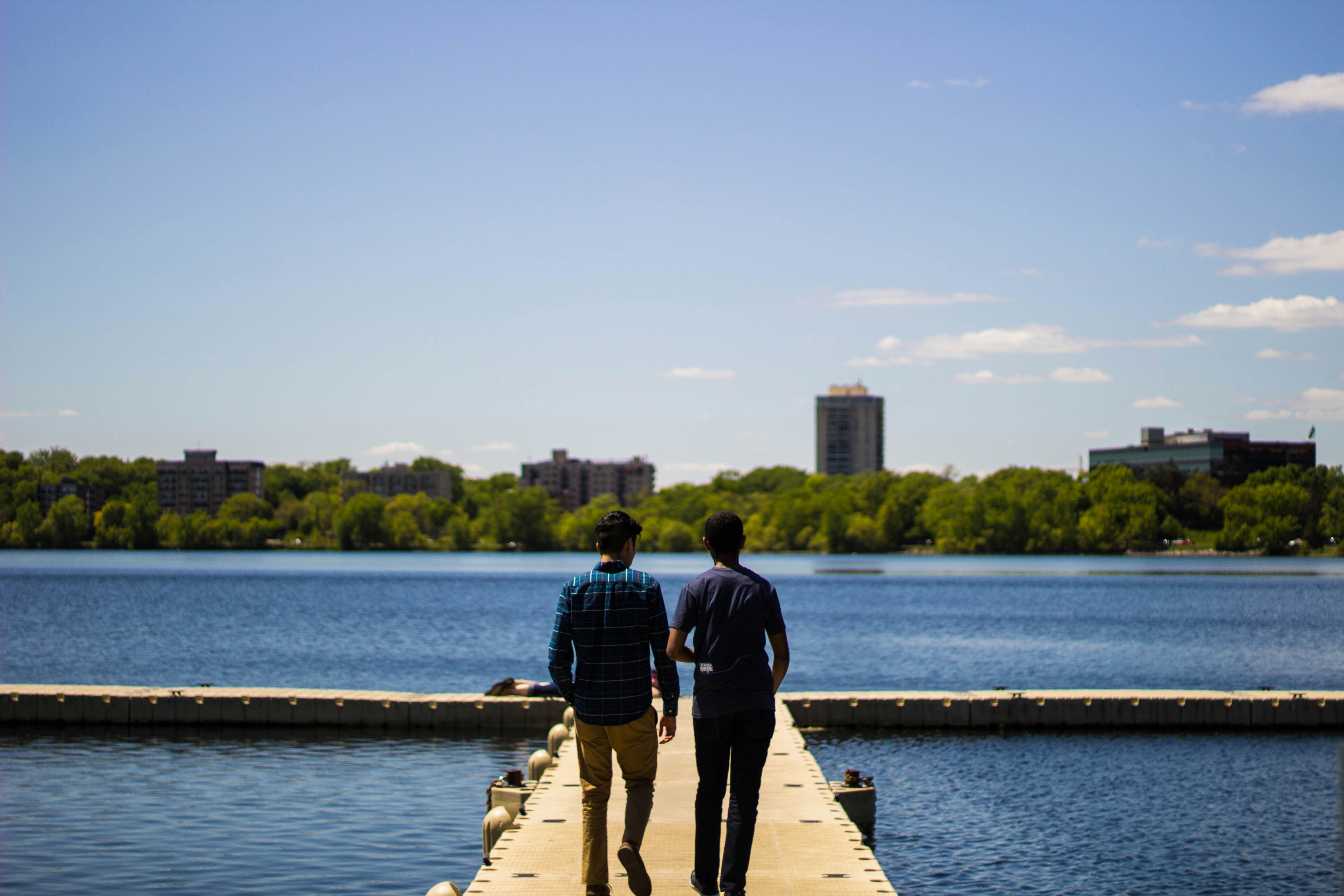 Footsteps Toward the City: A Quiet Moment on the Pier