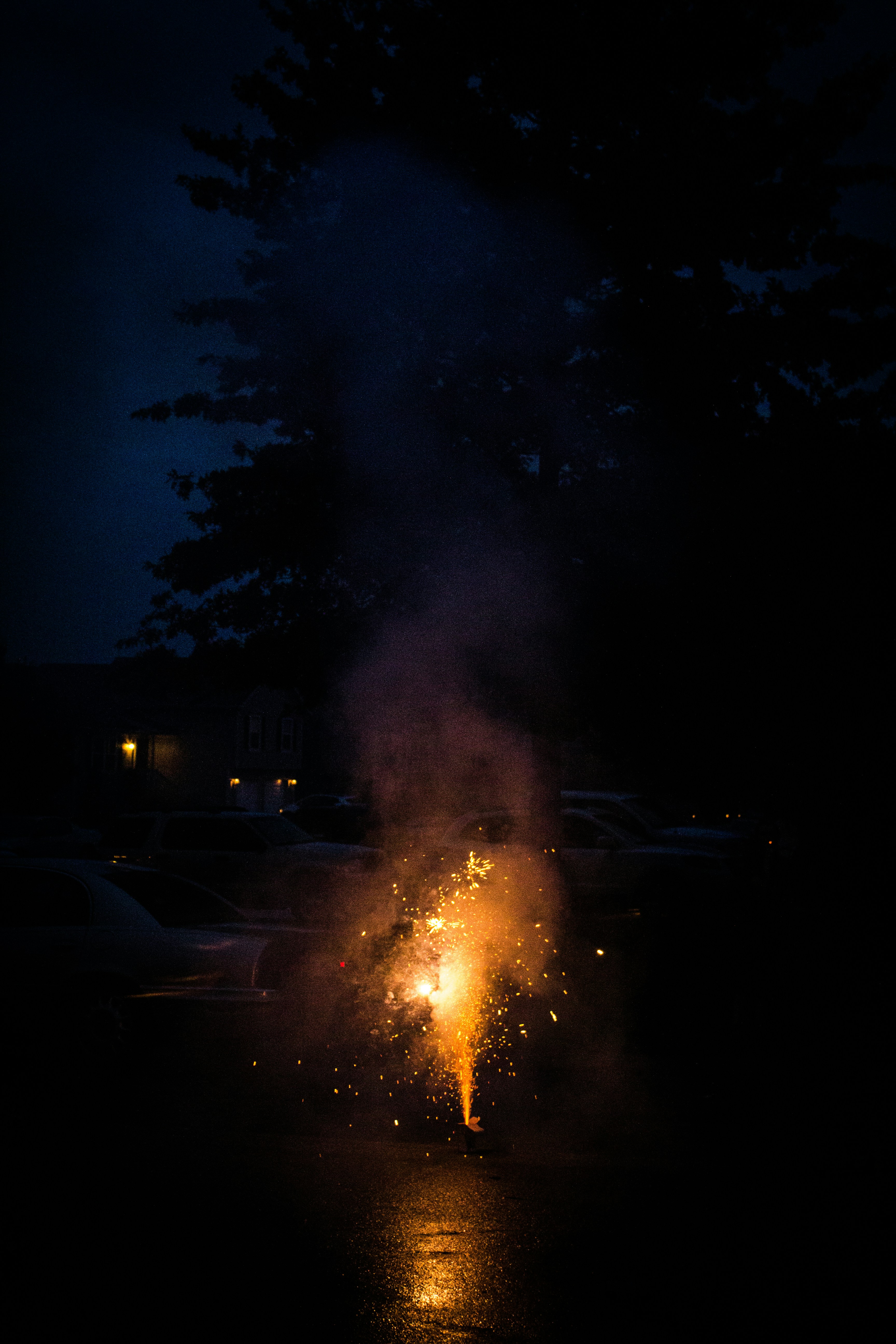 fire in the middle of the road during night time