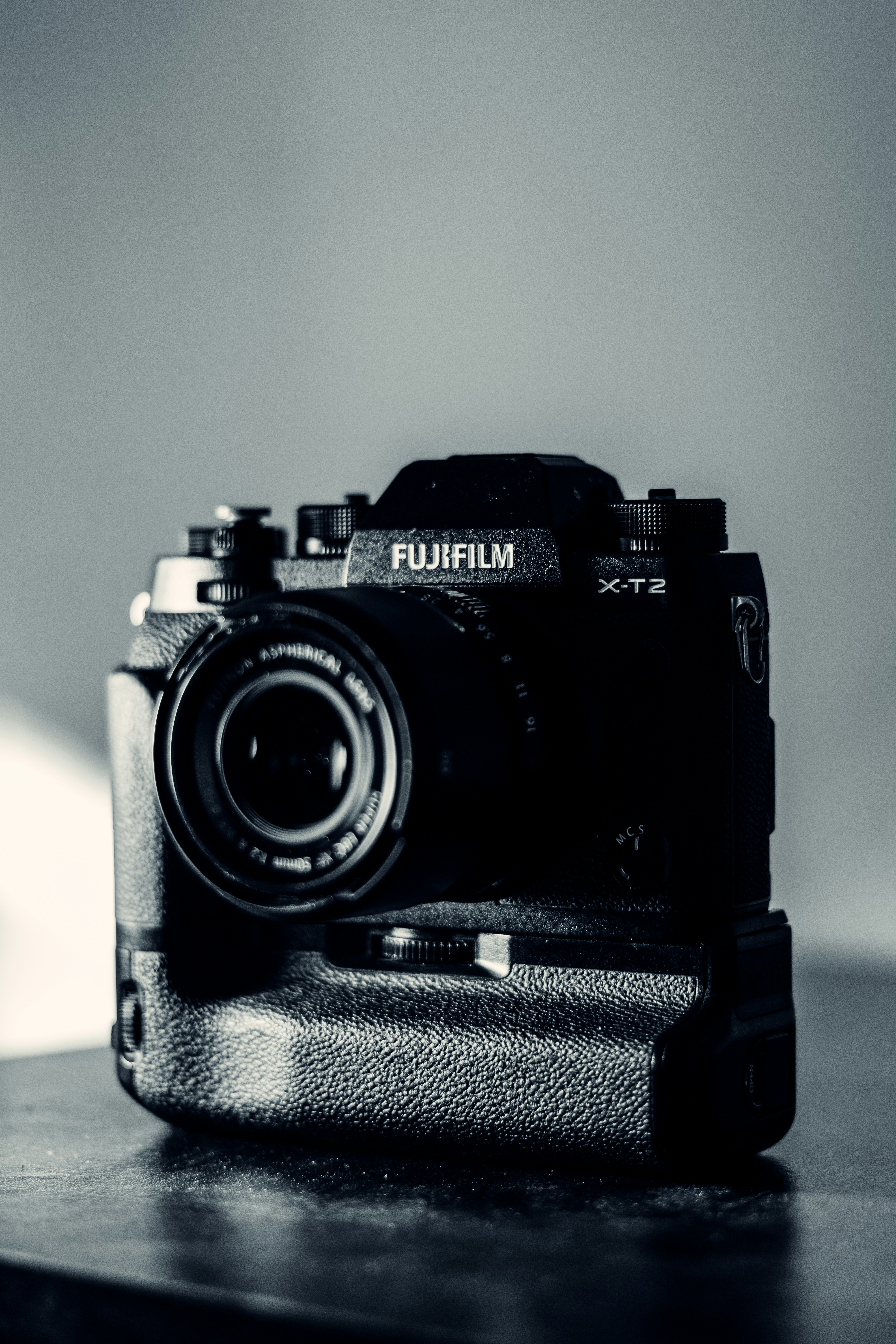 black nikon dslr camera on white table