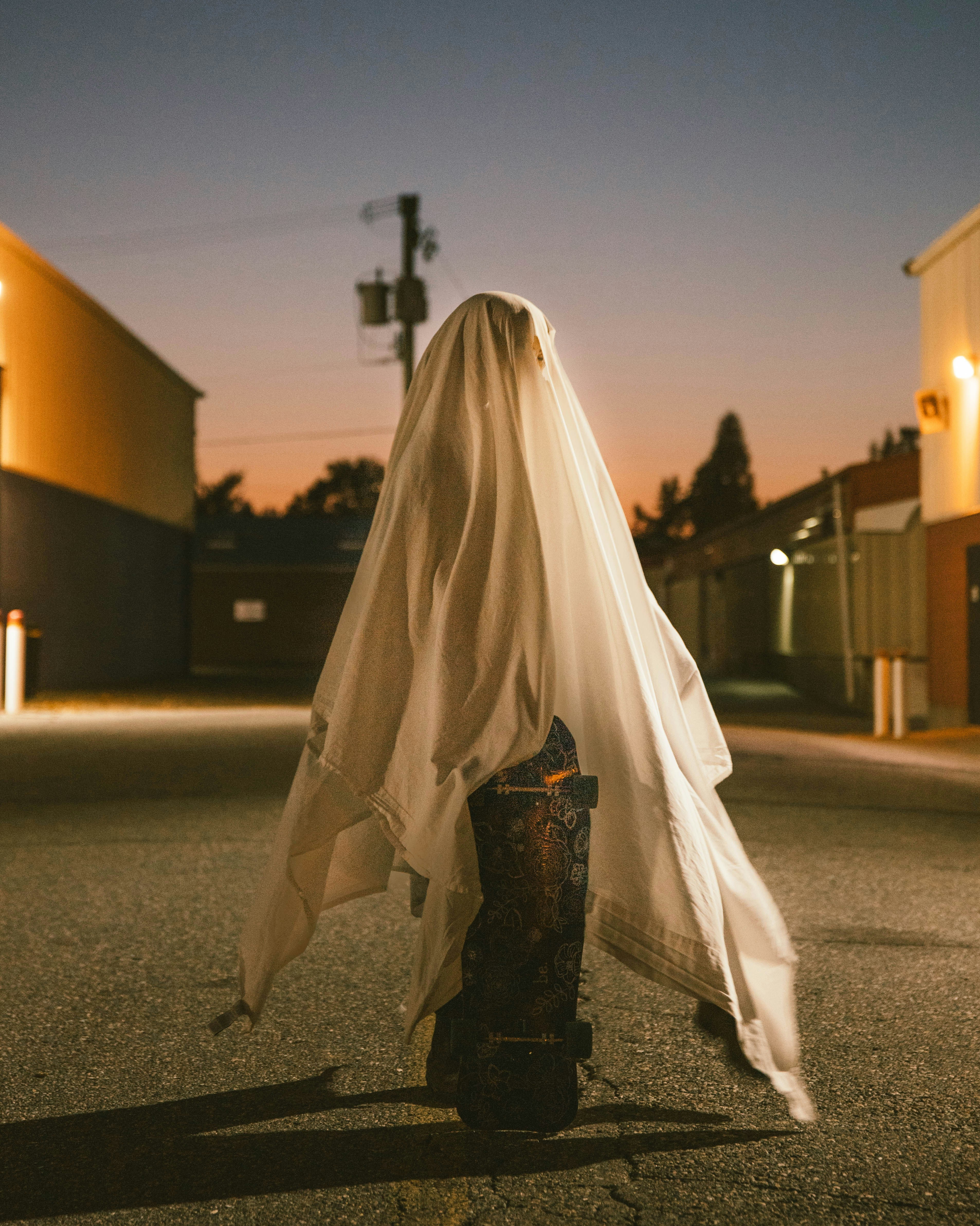 Dusk Walk of the Sheeted Stranger with a Guitar Case