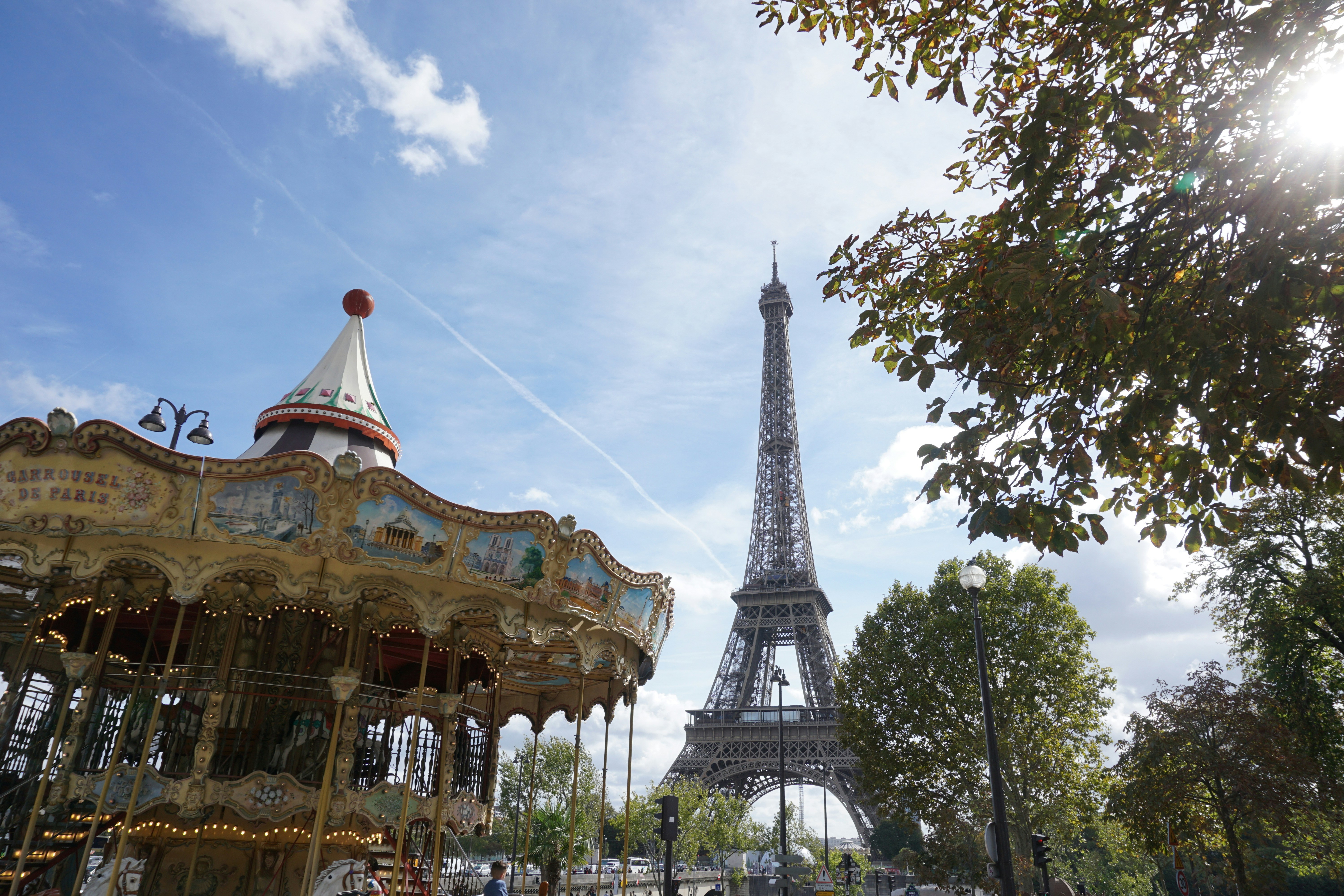 Carousel Reverie: The Eiffel Tower Framing a Parisian Daylight Moment