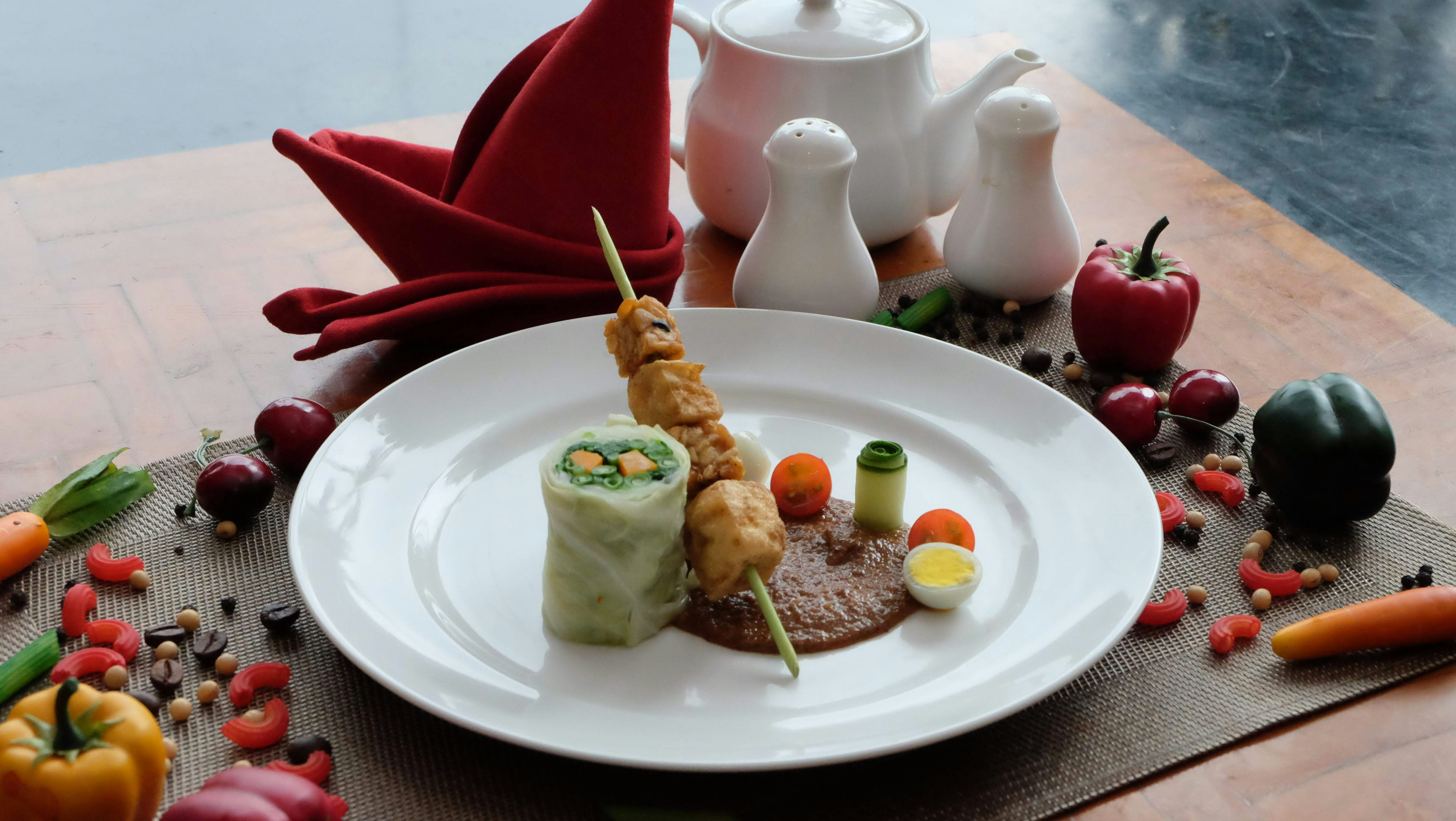 Skewers and Velvet Sauce: A Colorful Plate in Focus