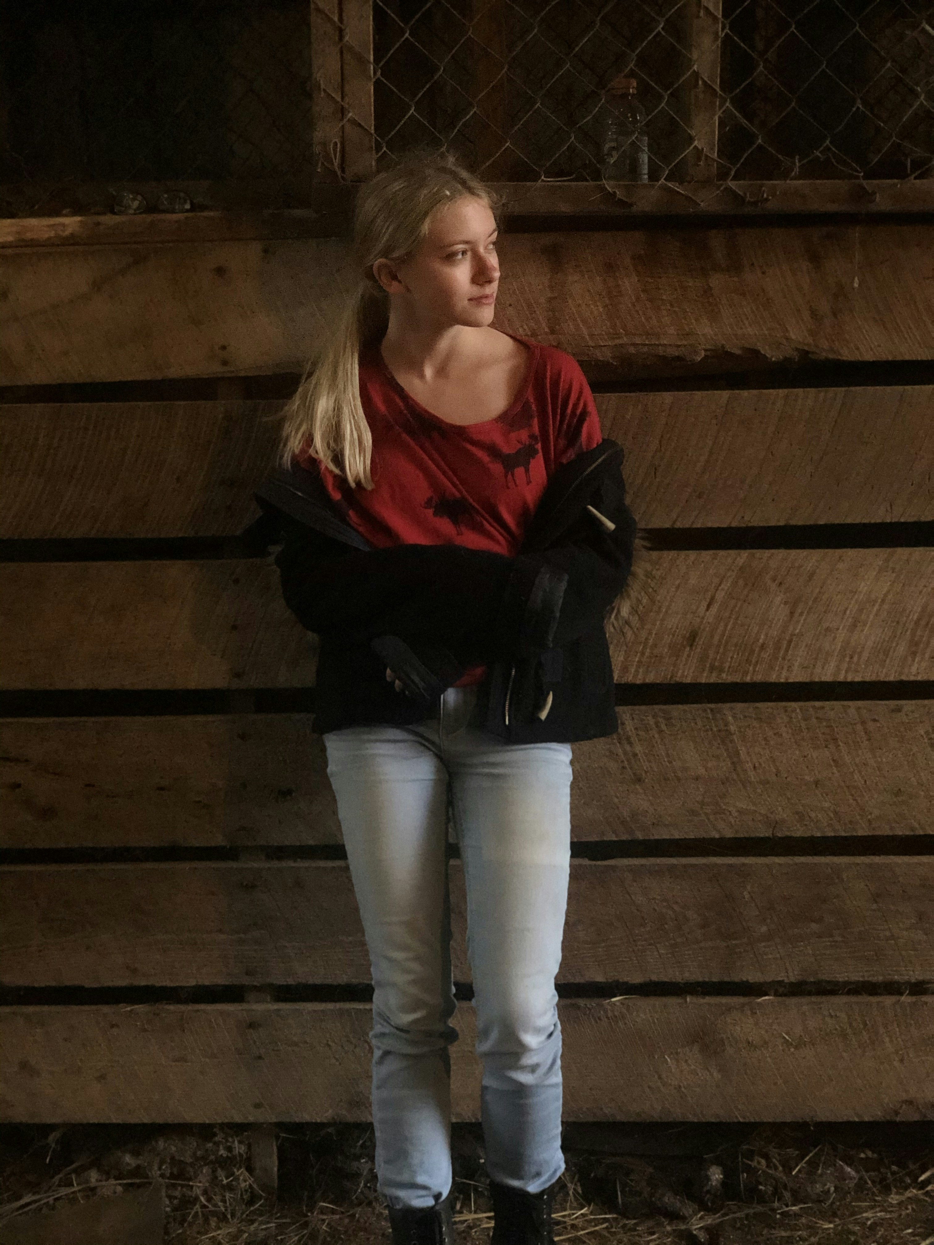 Portrait in the Barn Light: A Teen Reflecting Against Weathered Wood