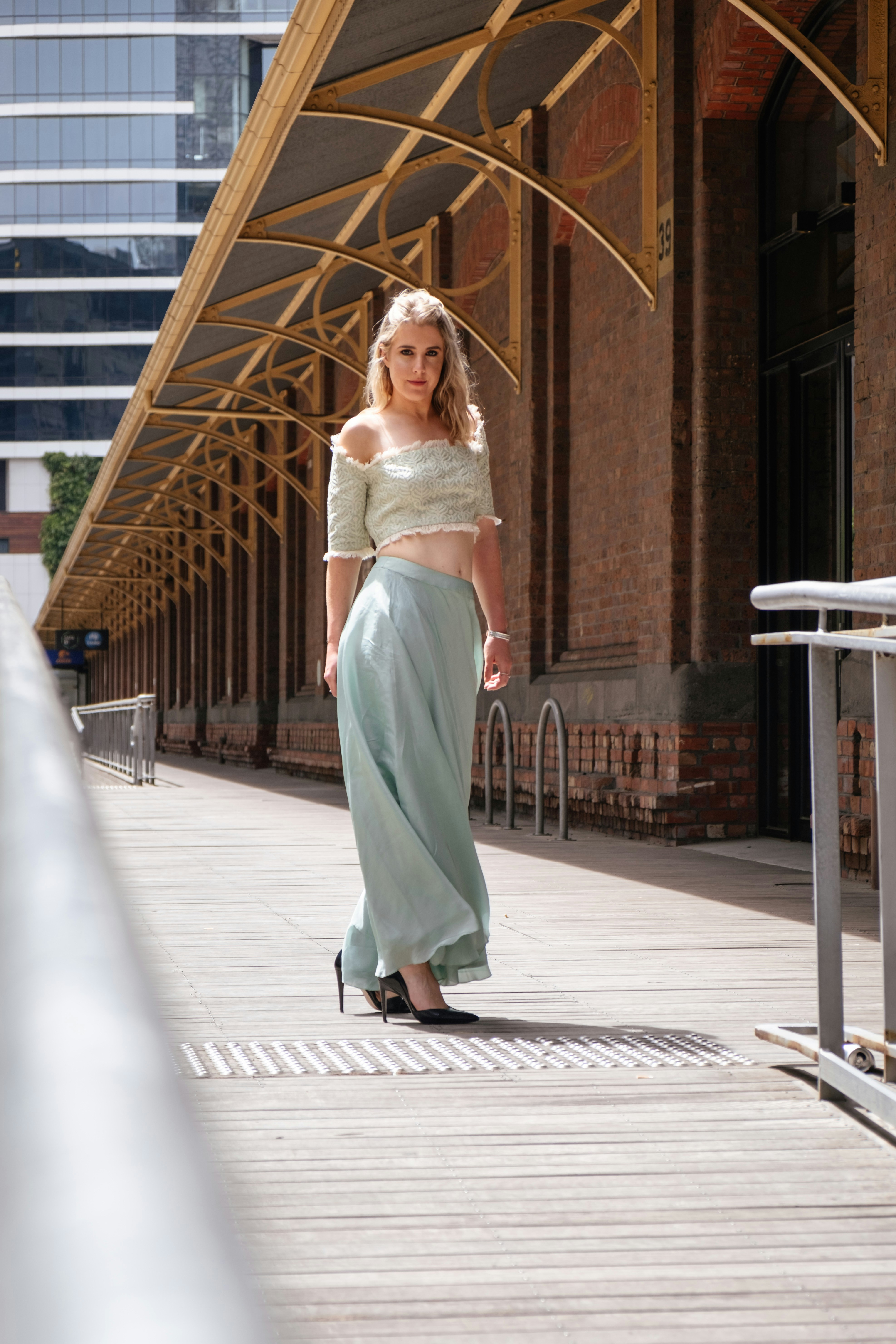 Sage Silk Under Brick Arches: A Quiet City Portrait