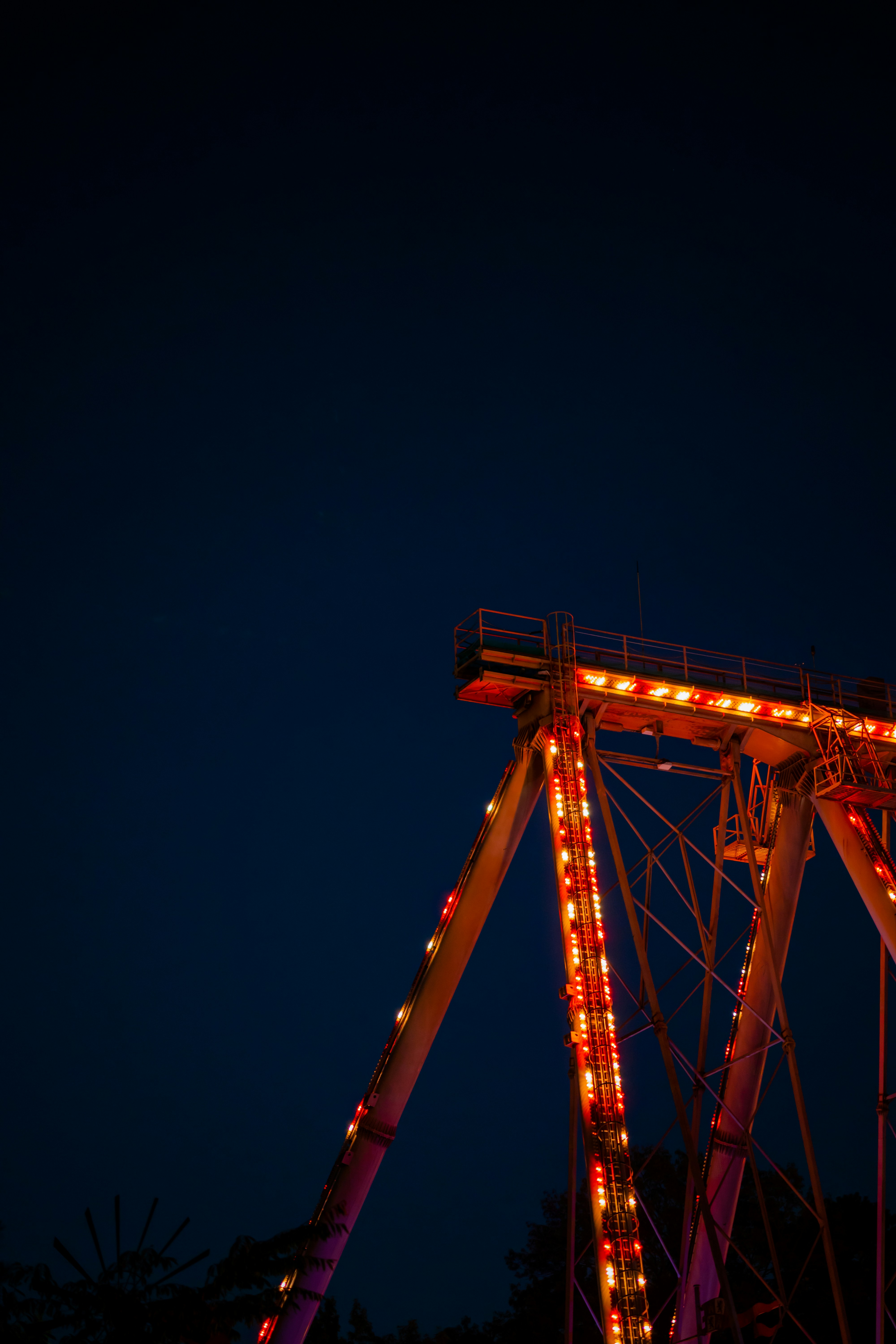 Orange tower with lights during night time photo – Free Architecture ...