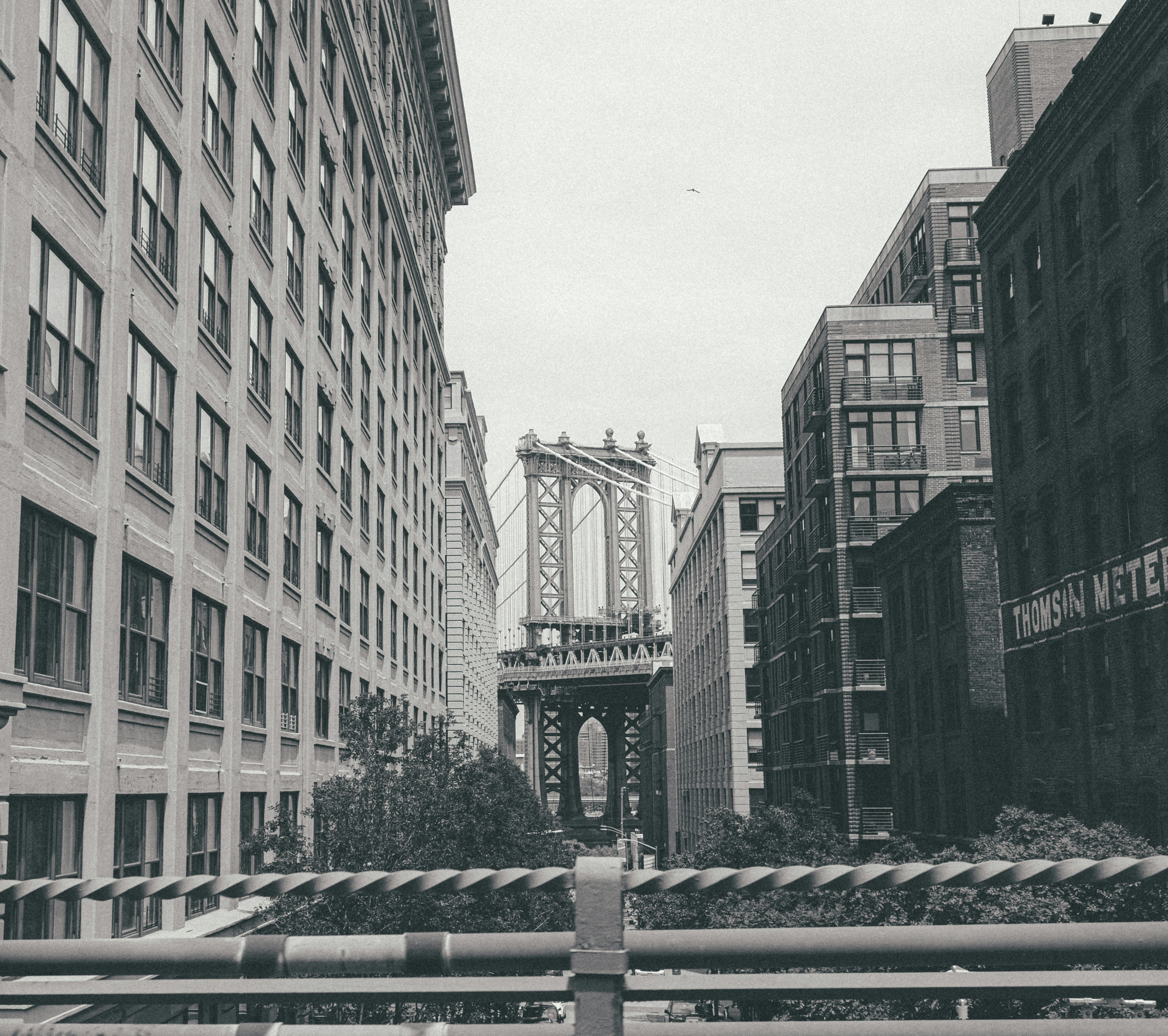 Bridge Structura: A Narrow Canyon Framed by City Towers