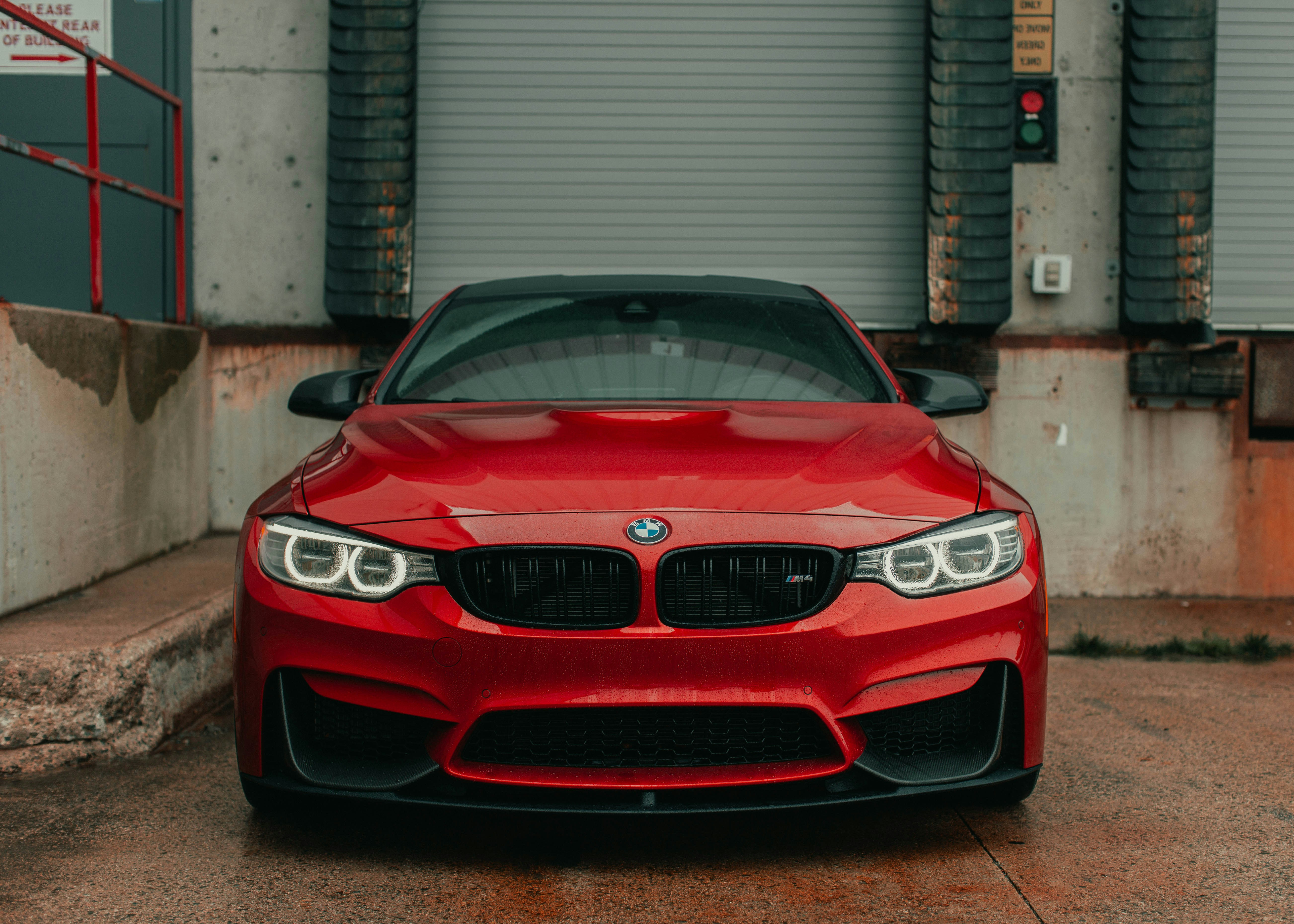Red bmw m 3 parked near white roll up door photo – Free Red Image on ...
