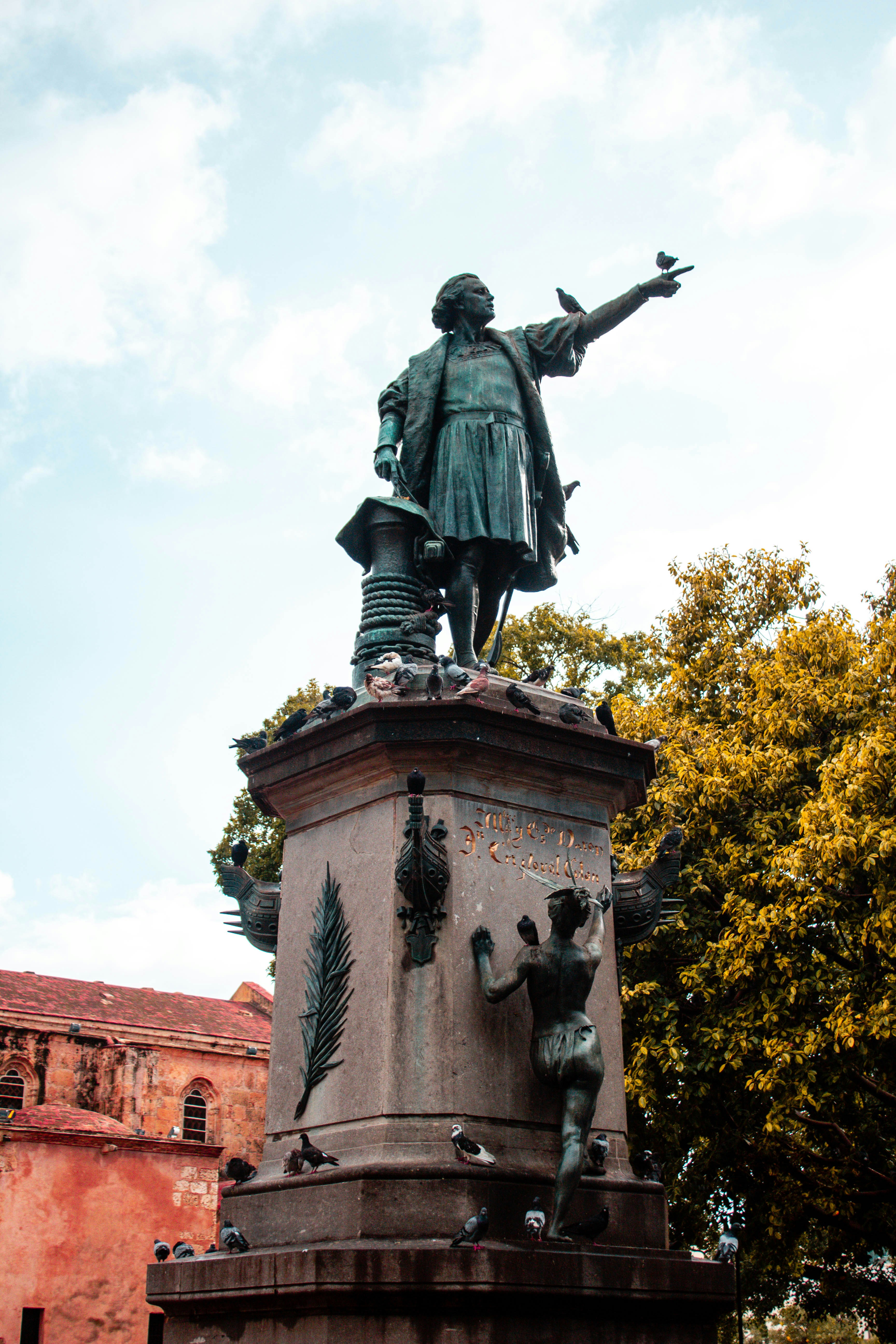 a statue of a man with a bird on his arm