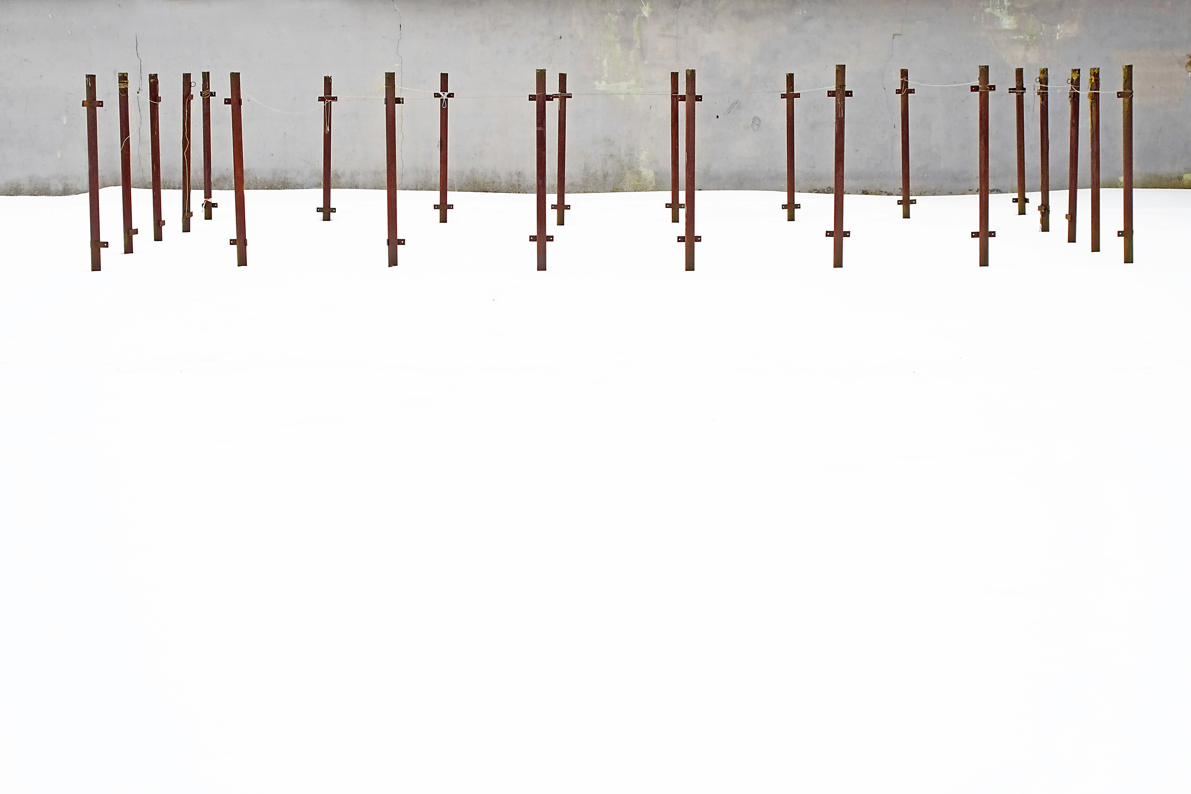 Rusty pins over a sea of white