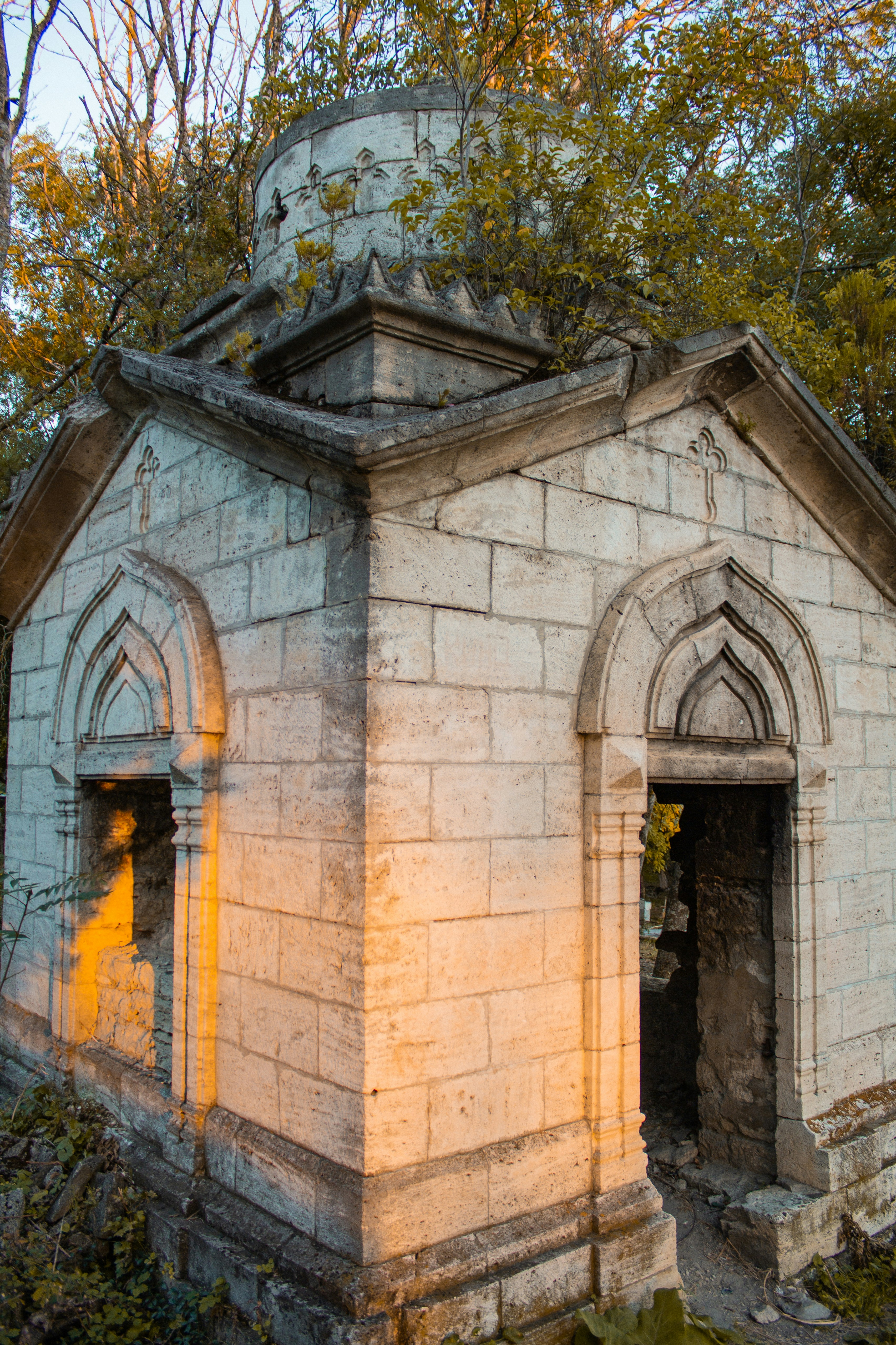 Autumn Light Traces the Weathered Mausoleum