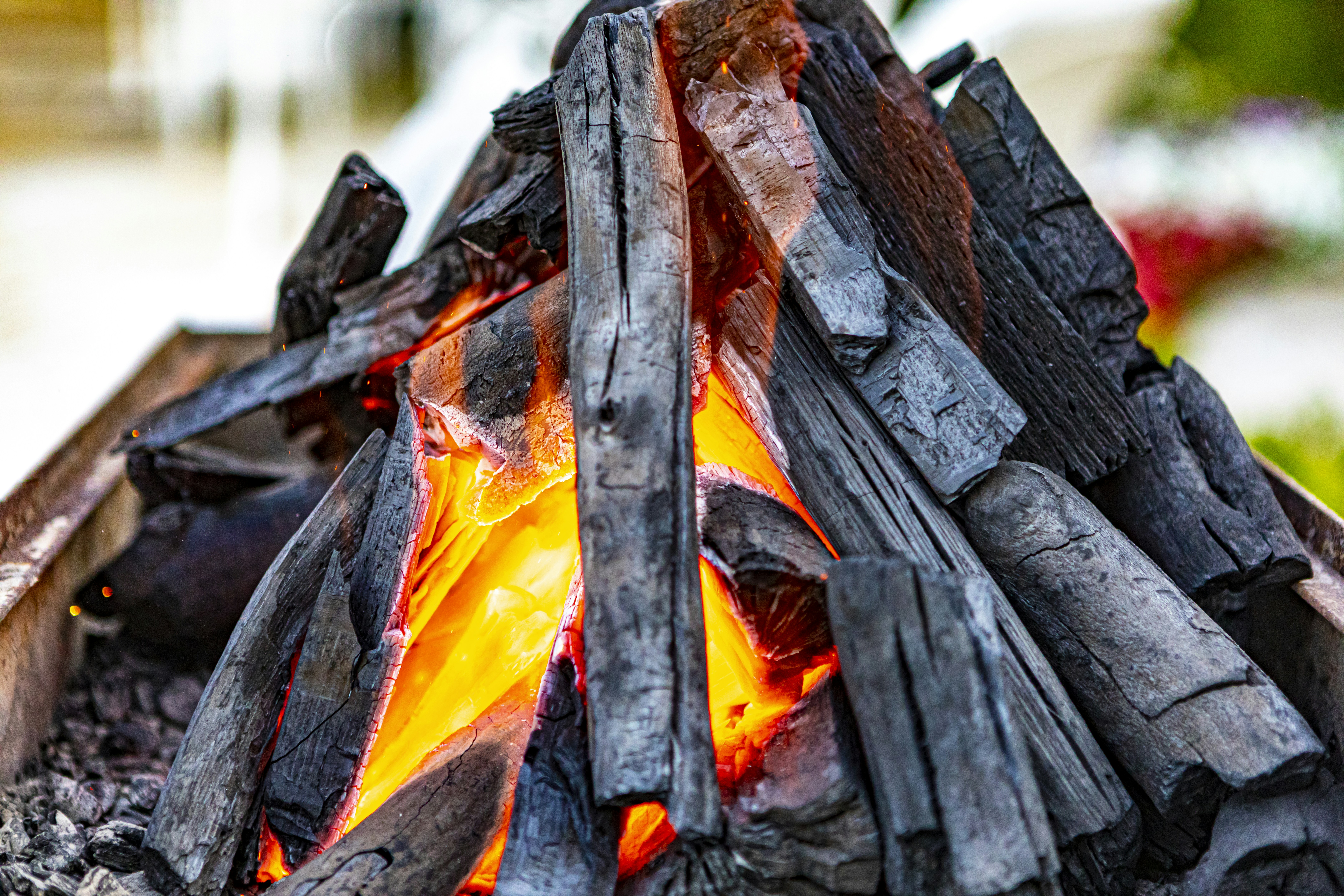 Ember Lattice: close-up of glowing charcoal towers under flickering flame
