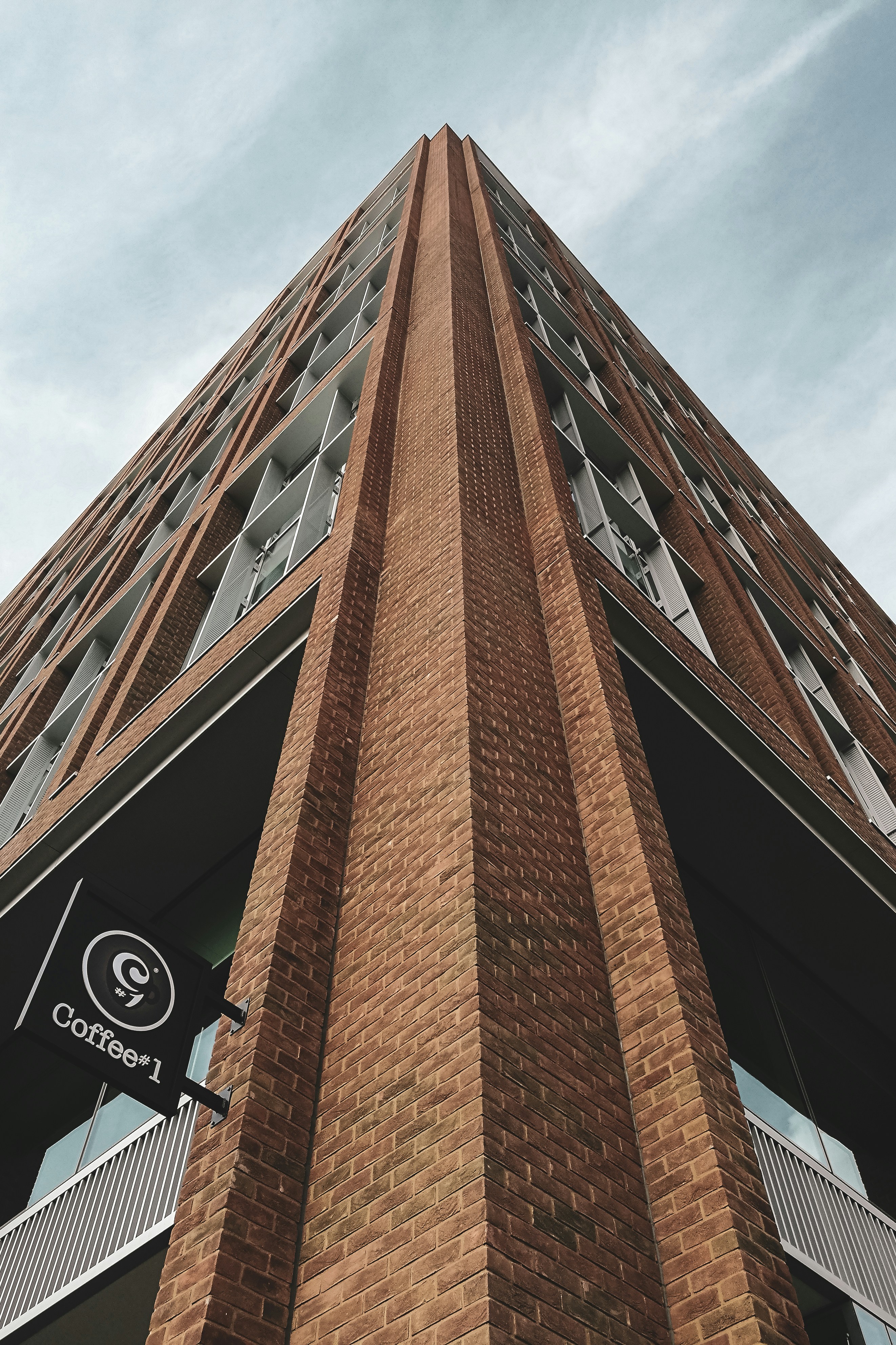 Brick Tower Ascendant: A Low-Angle Portrait of a Commercial Giant