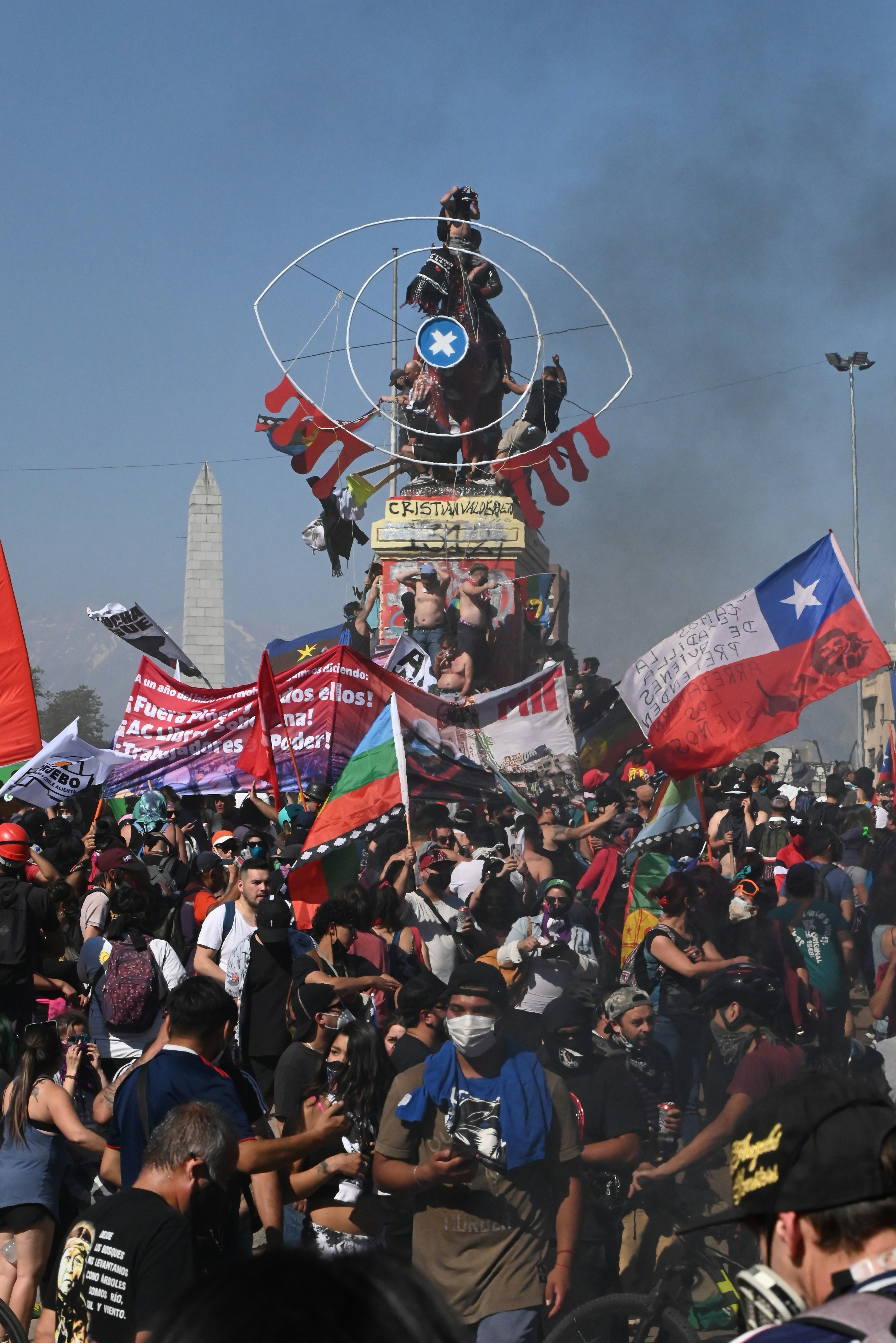 Rise Above the Crowd: Monumental Parade and Statue at Dusk