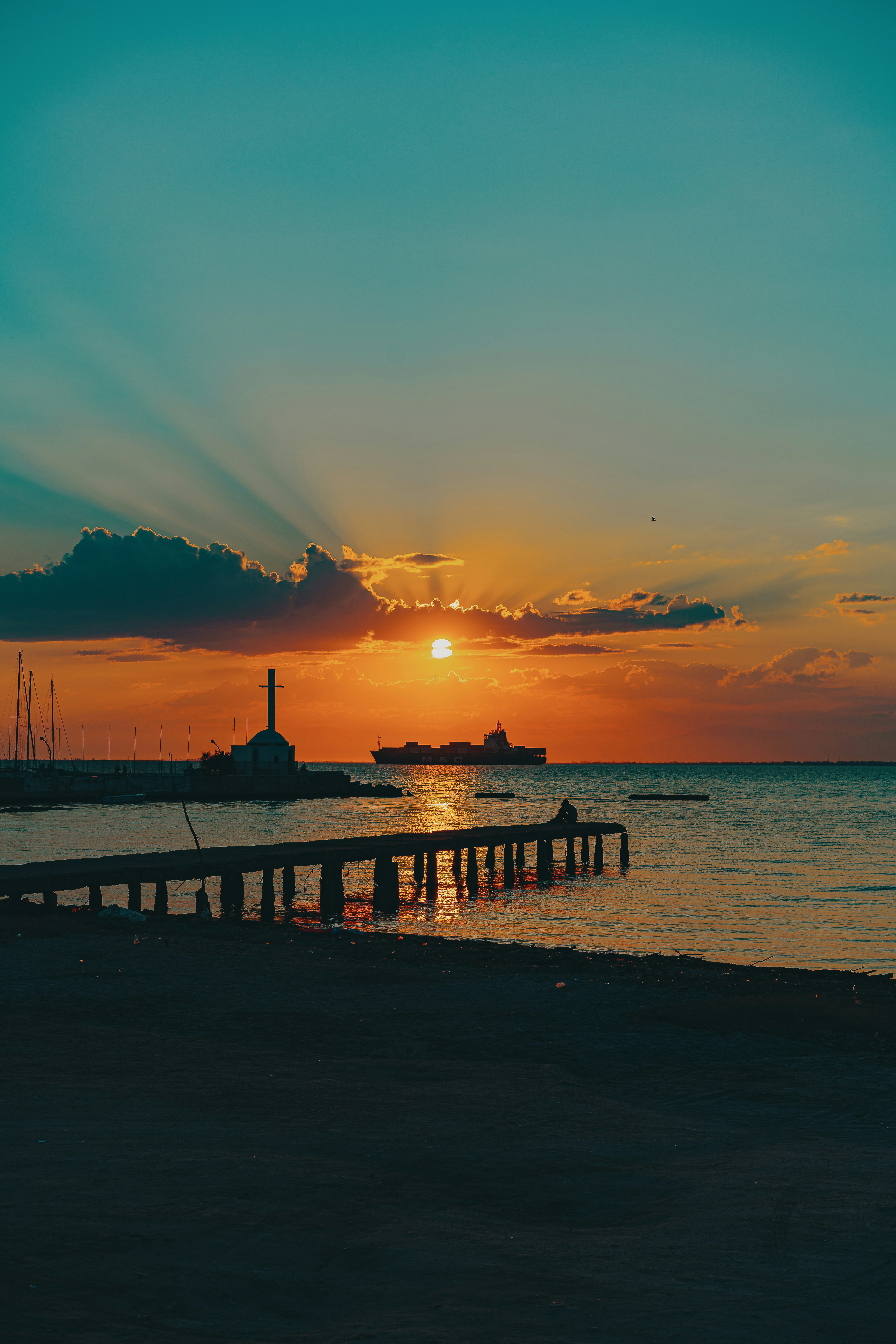 Last Light at the Pier: Boats, Silhouettes, and a Fiery Horizon