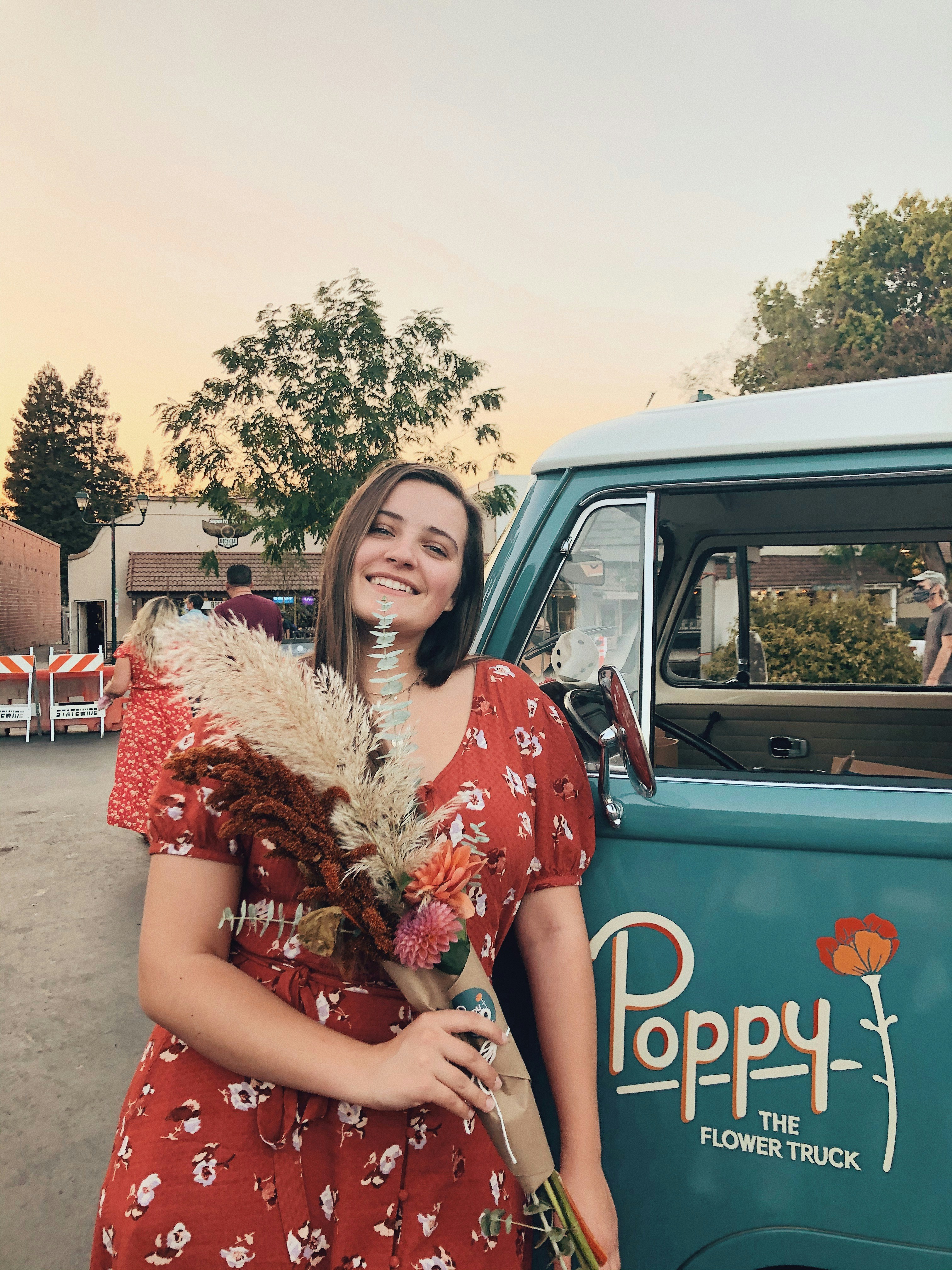 Sunlit Smile by the Poppy Flower Truck