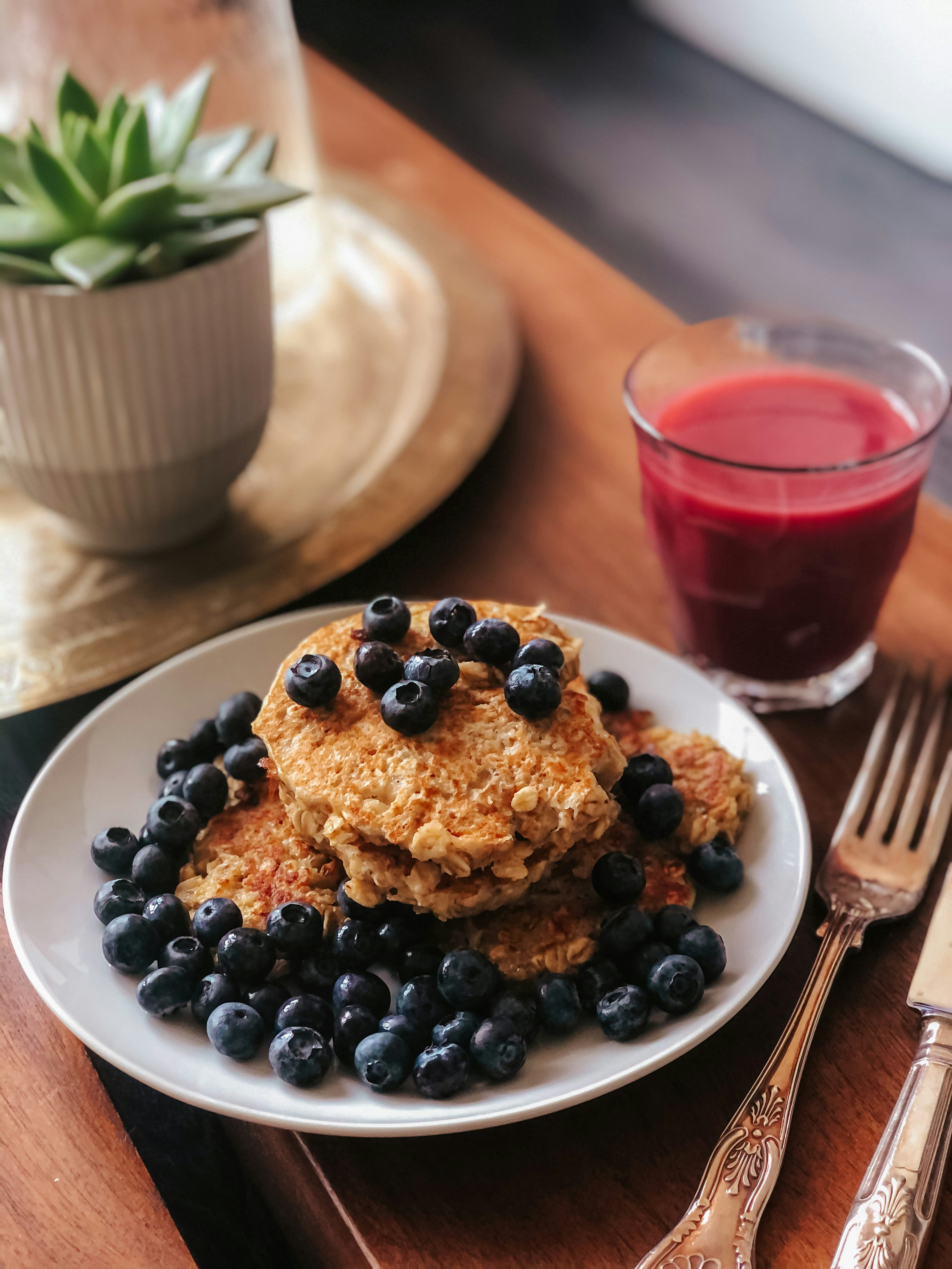 Blueberry-topped Oat Crisp Duo on a Rustic Table