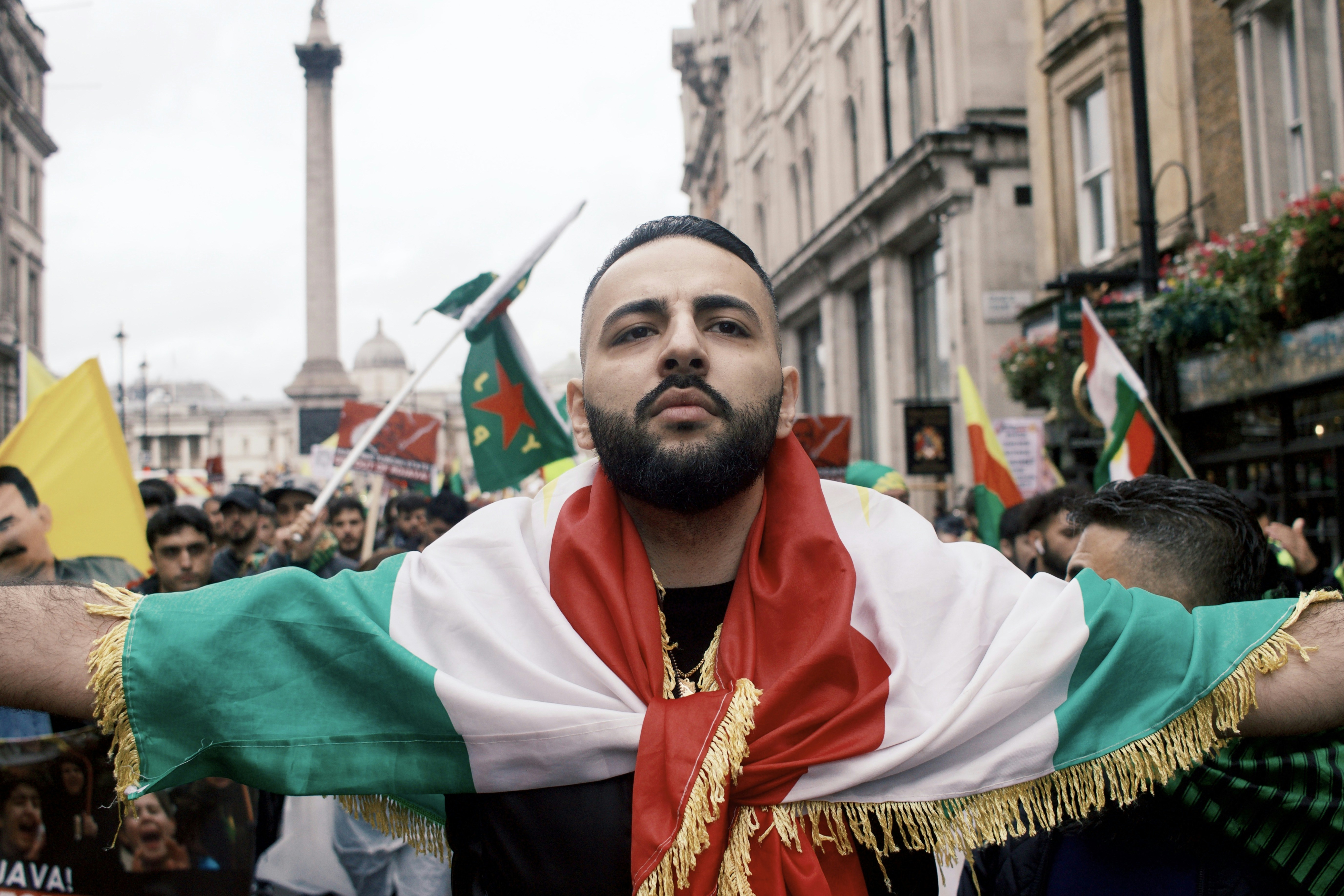 Flag-wrapped Leader Amid a Tervented Crowd