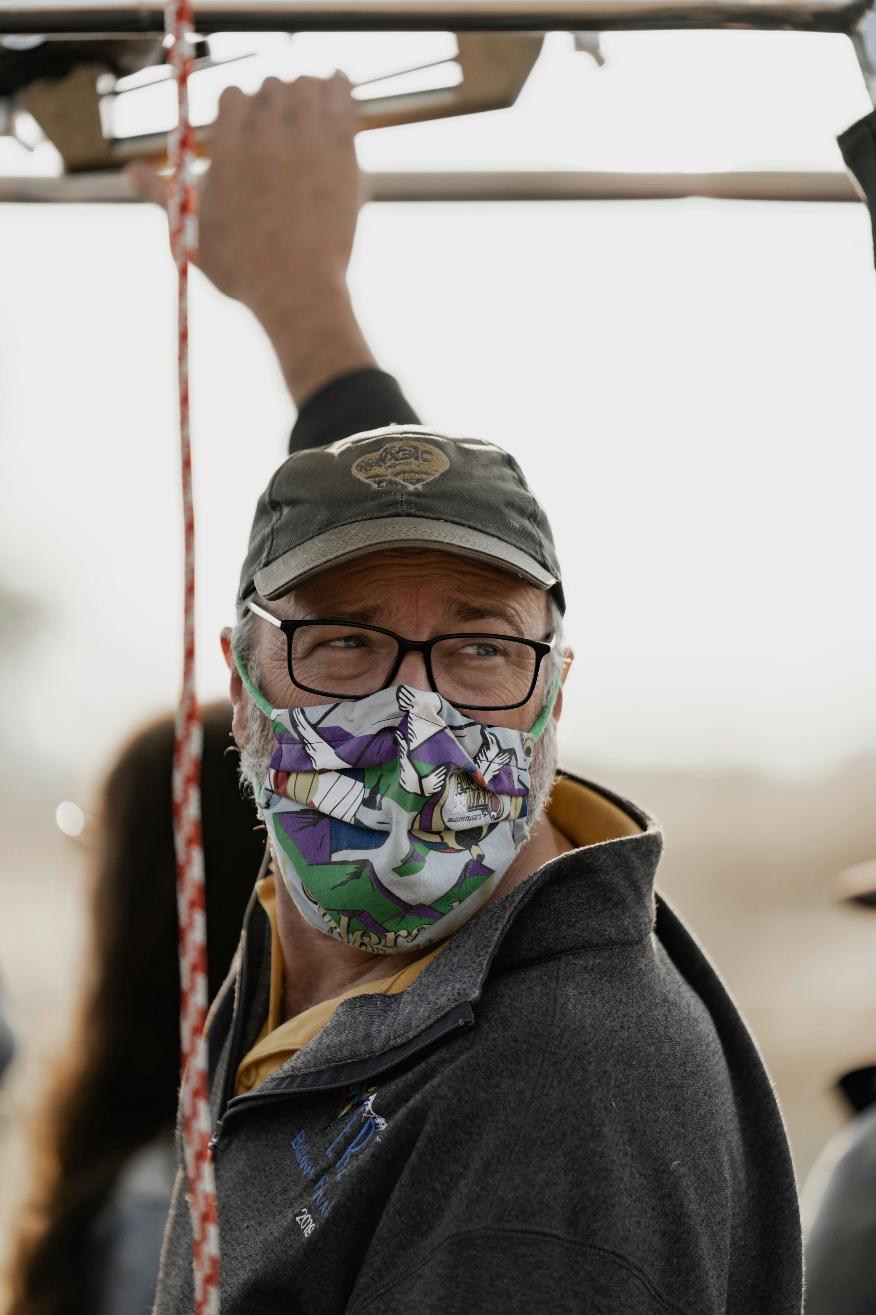Colorfully Masked Foreman Under a Construction Framework