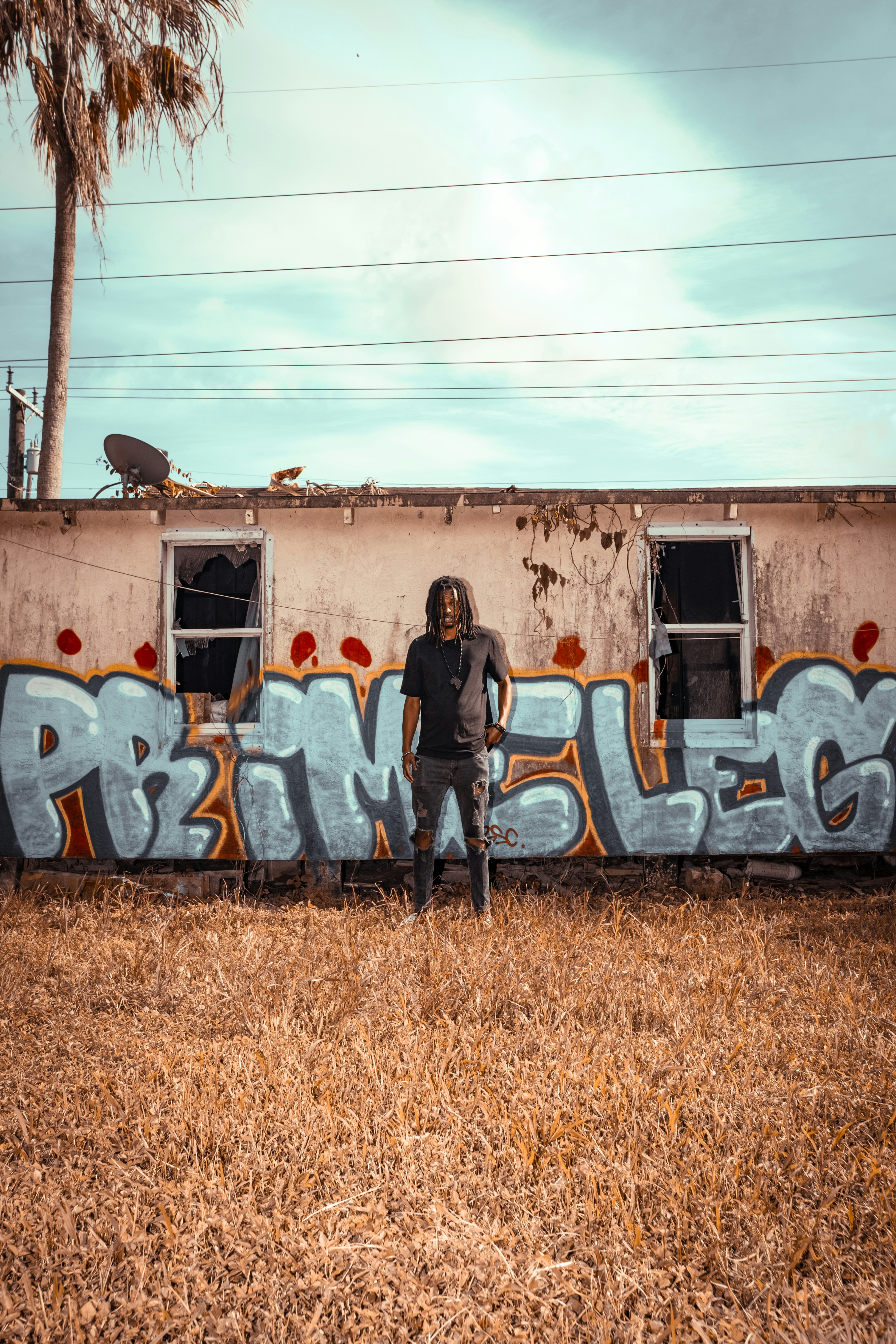 Graffiti Wall Portrait in a Sunlit Lot