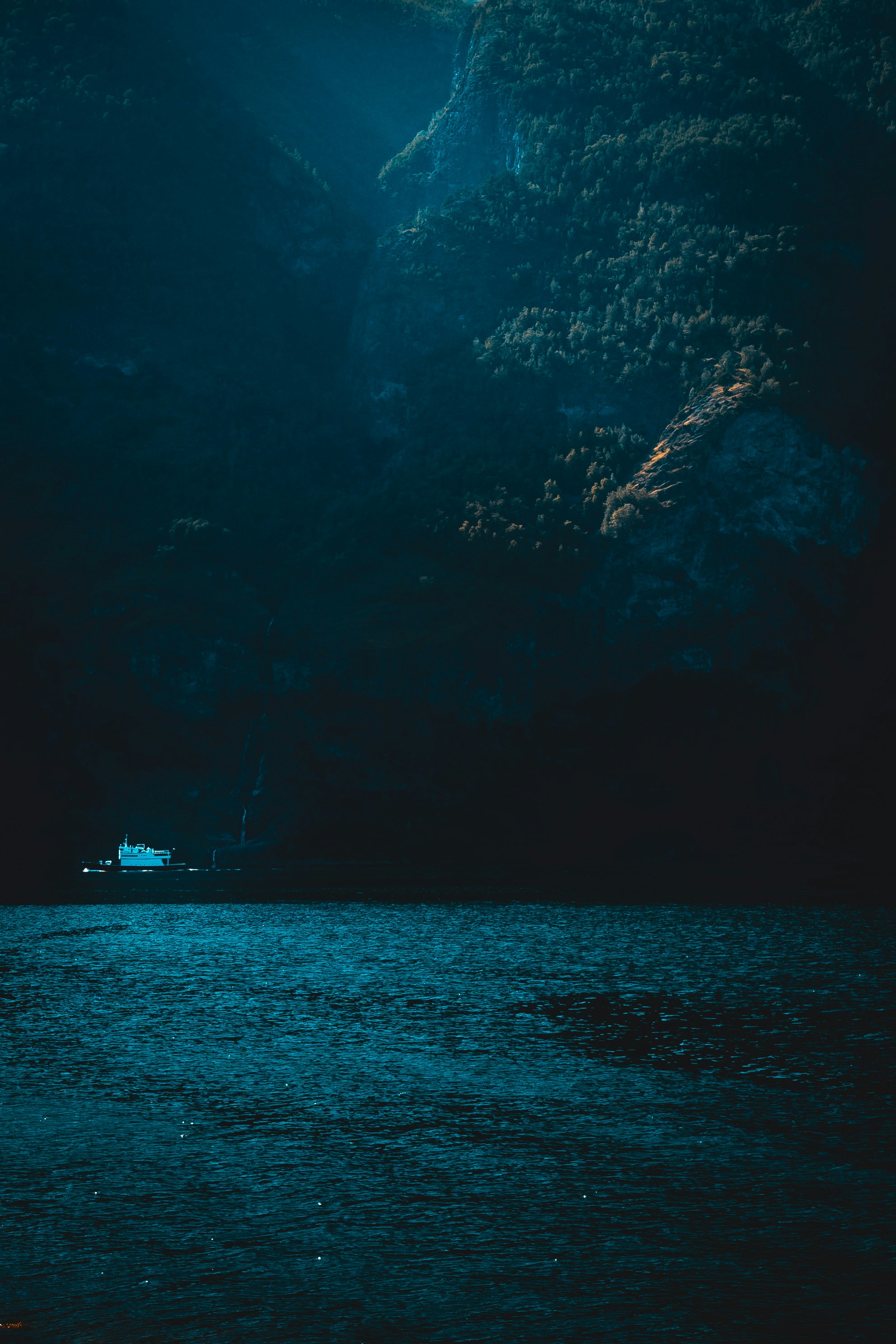 Lone Vessel at the Blue Fjord's Shadow