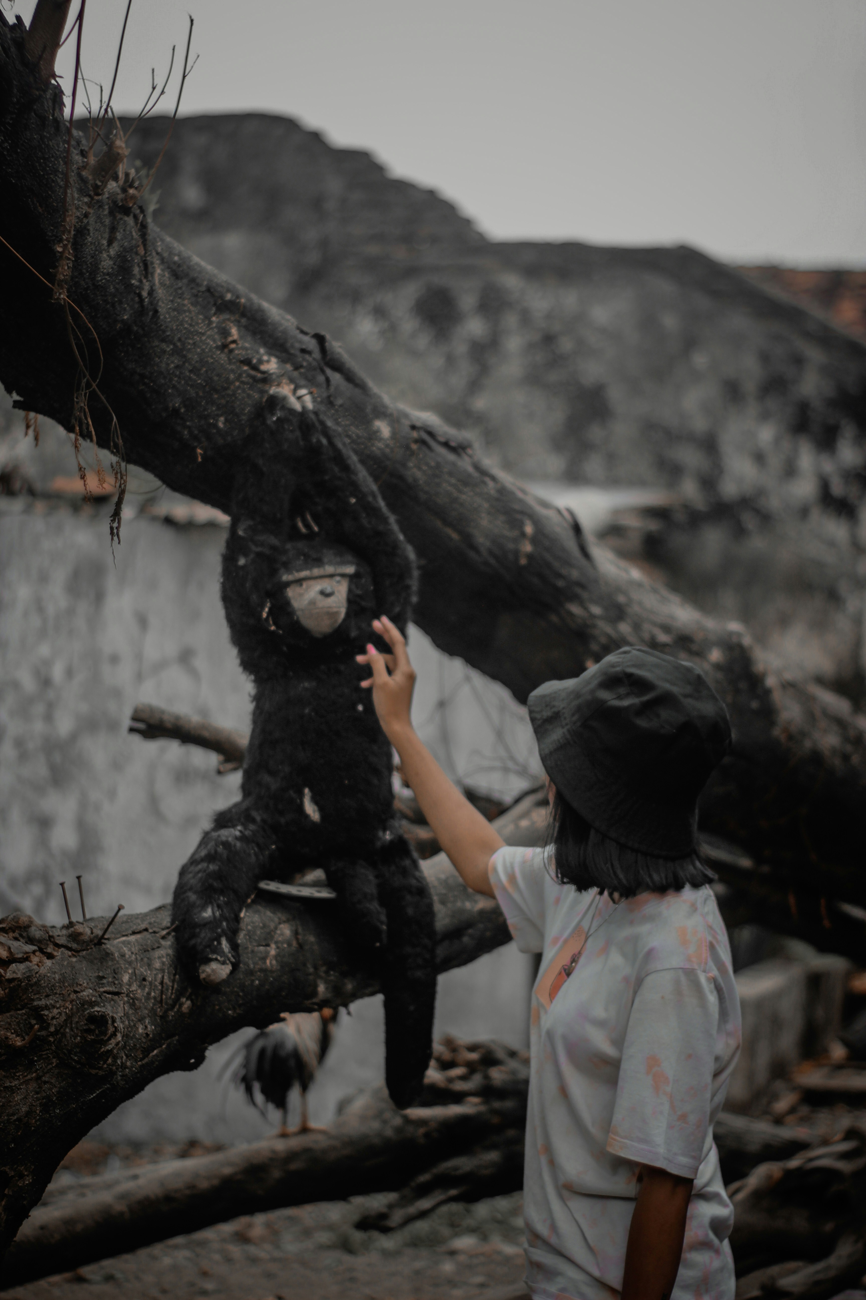 Child Reaches for a Fallen Colossus: A Quiet Moment Among Ruins