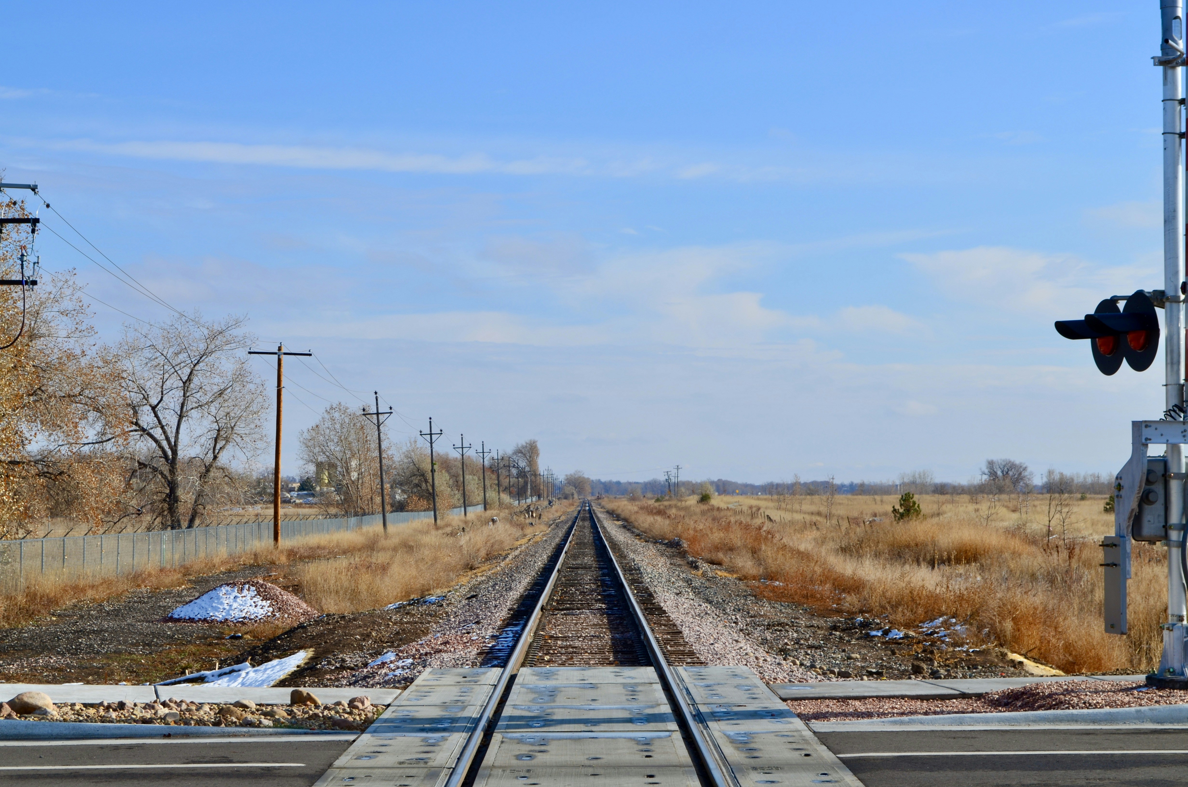 Vanishing Rails: A Quiet Crossing Toward the Distant Horizon