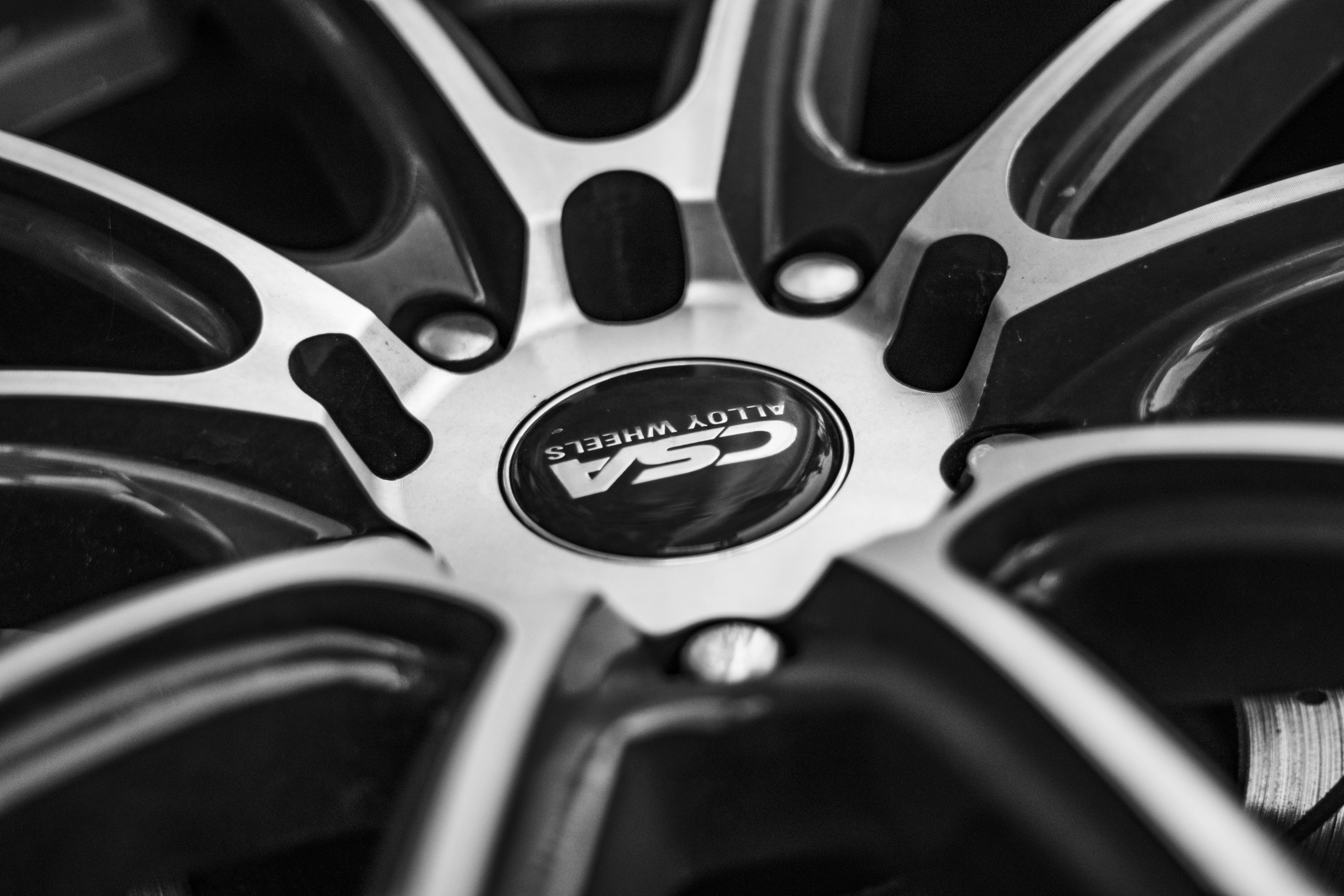 Concentric Quietude: A Macro Portrait of a Wheel Center Cap