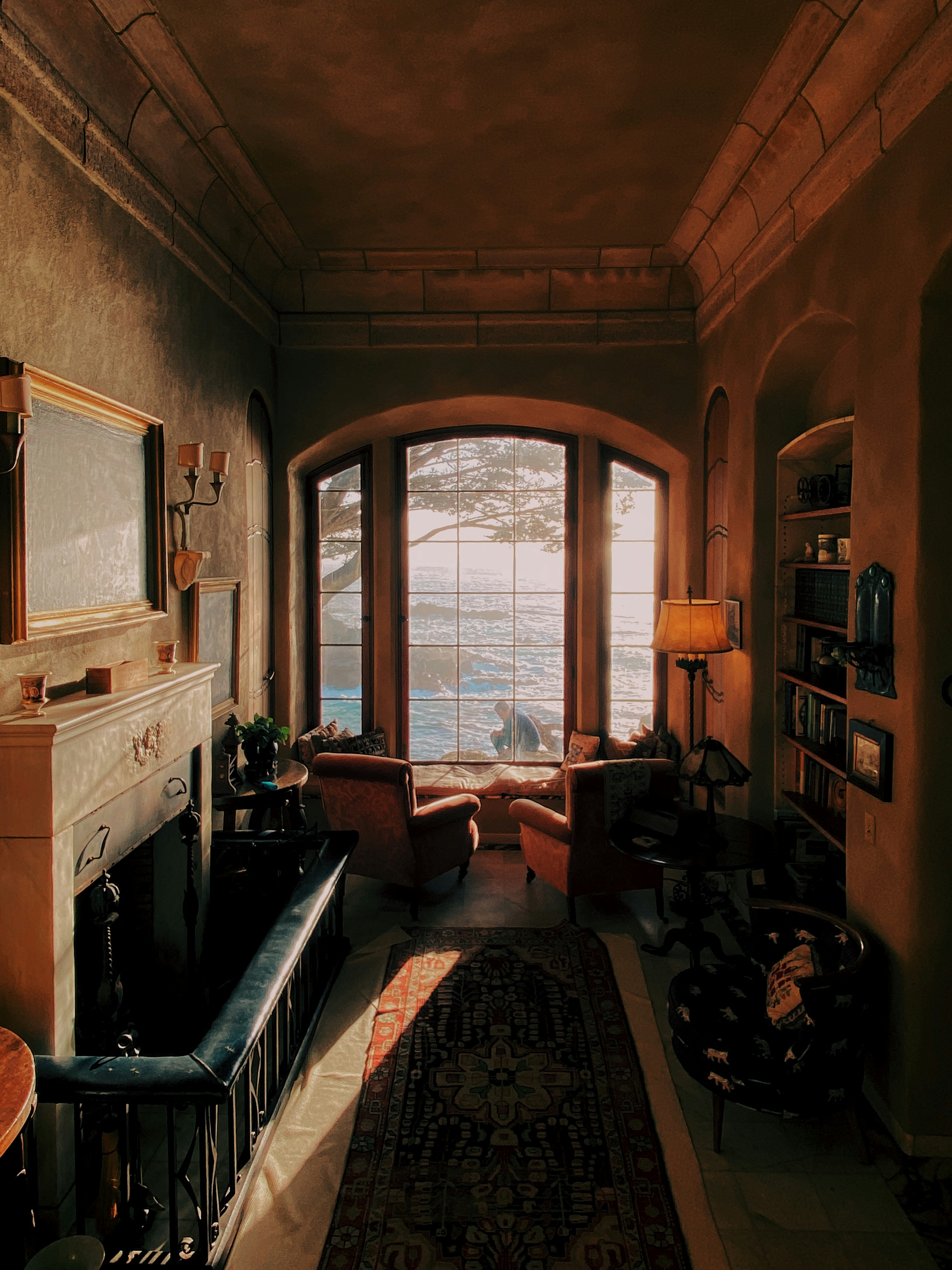 Amber Parlor Window: Seascape Framed by a Hearthside Retreat