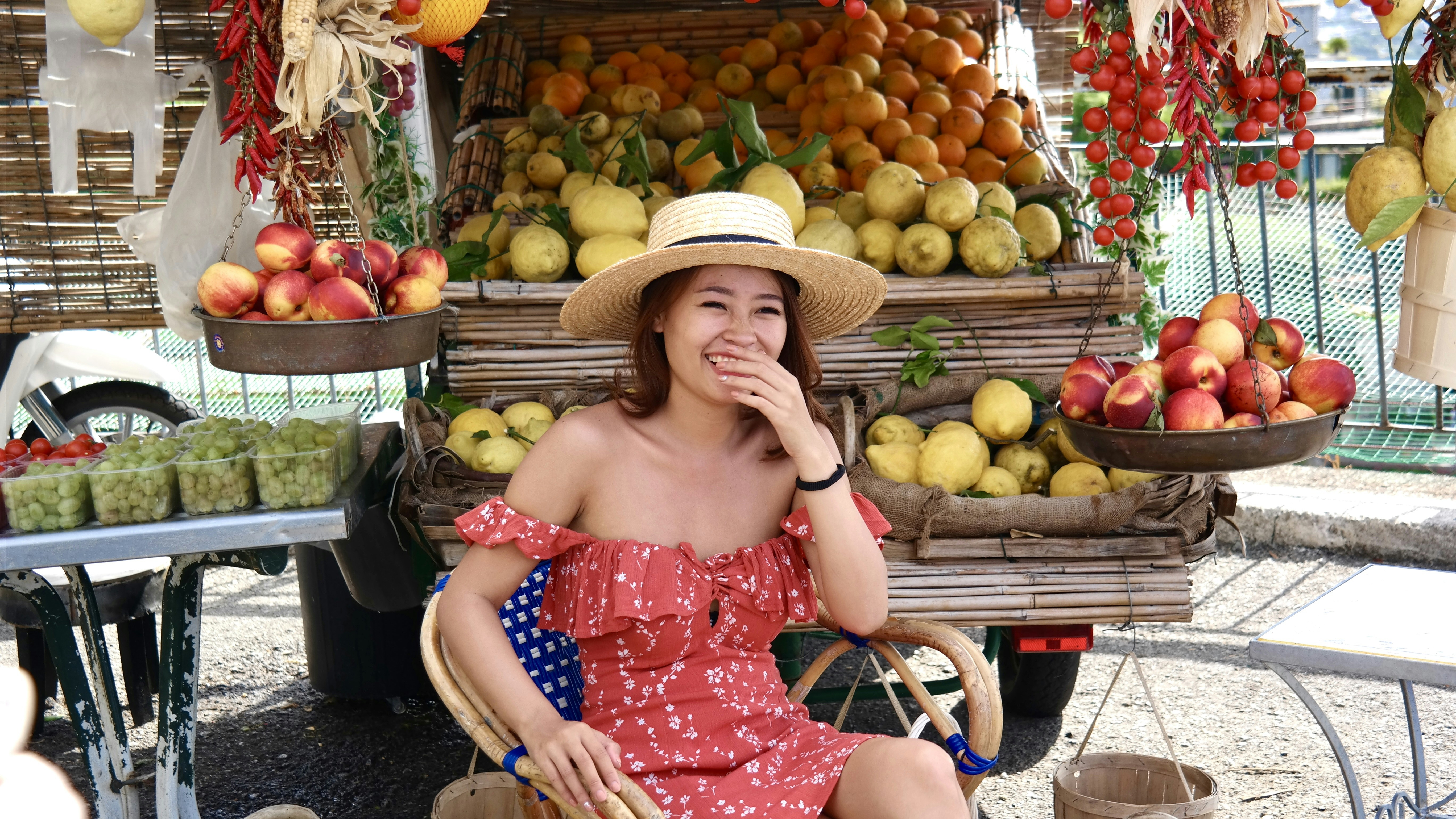 Sunlit Botanic Bazaar: A Sunhat Moment at the Fruit Cart