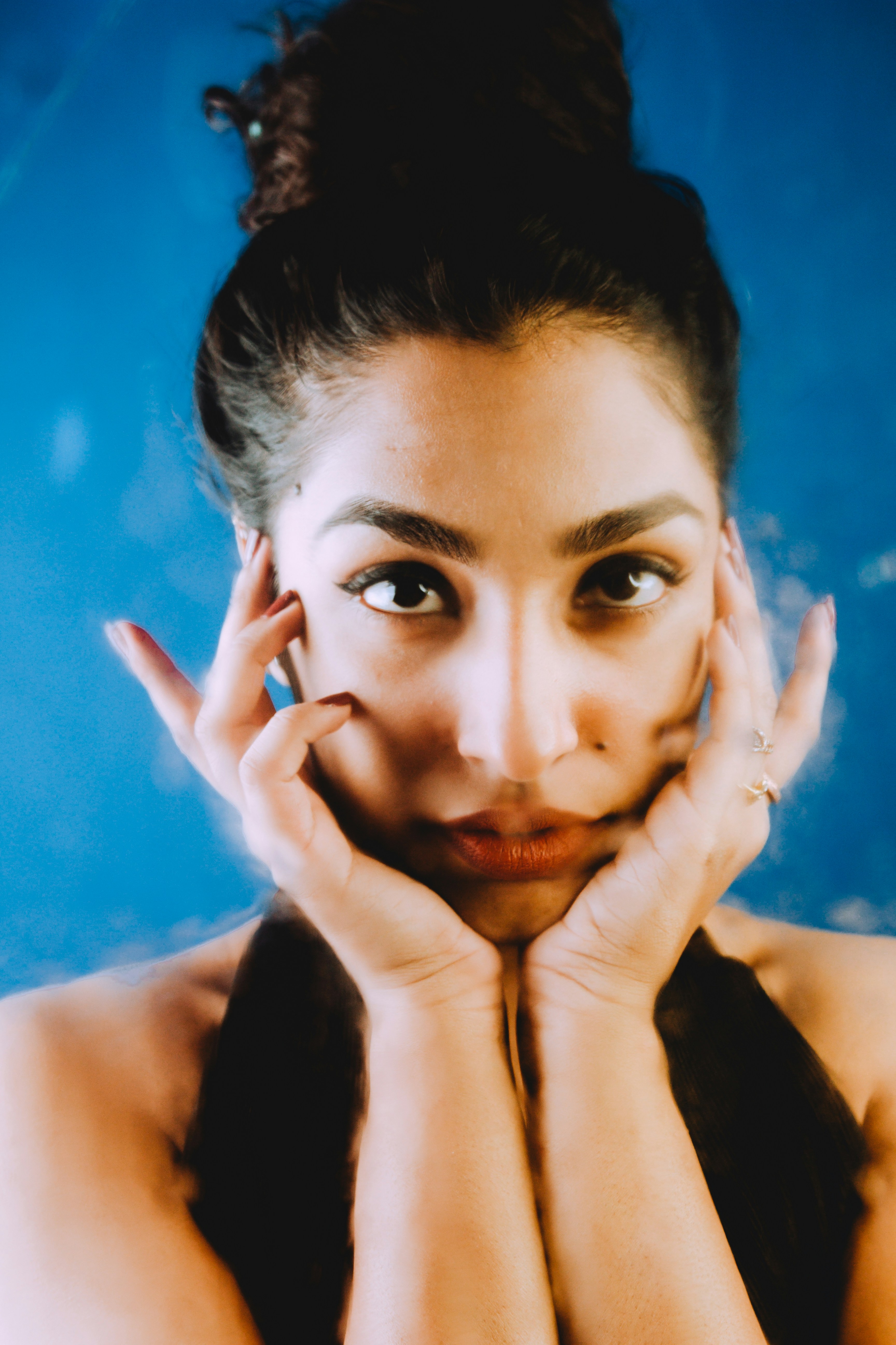 Portrait in Blue: A Close-Up of Quiet Intensity