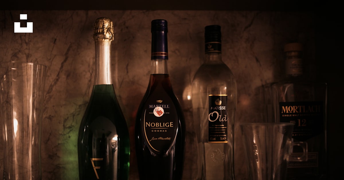 Black Glass Bottle Beside Clear Drinking Glass Photo Free Bottle