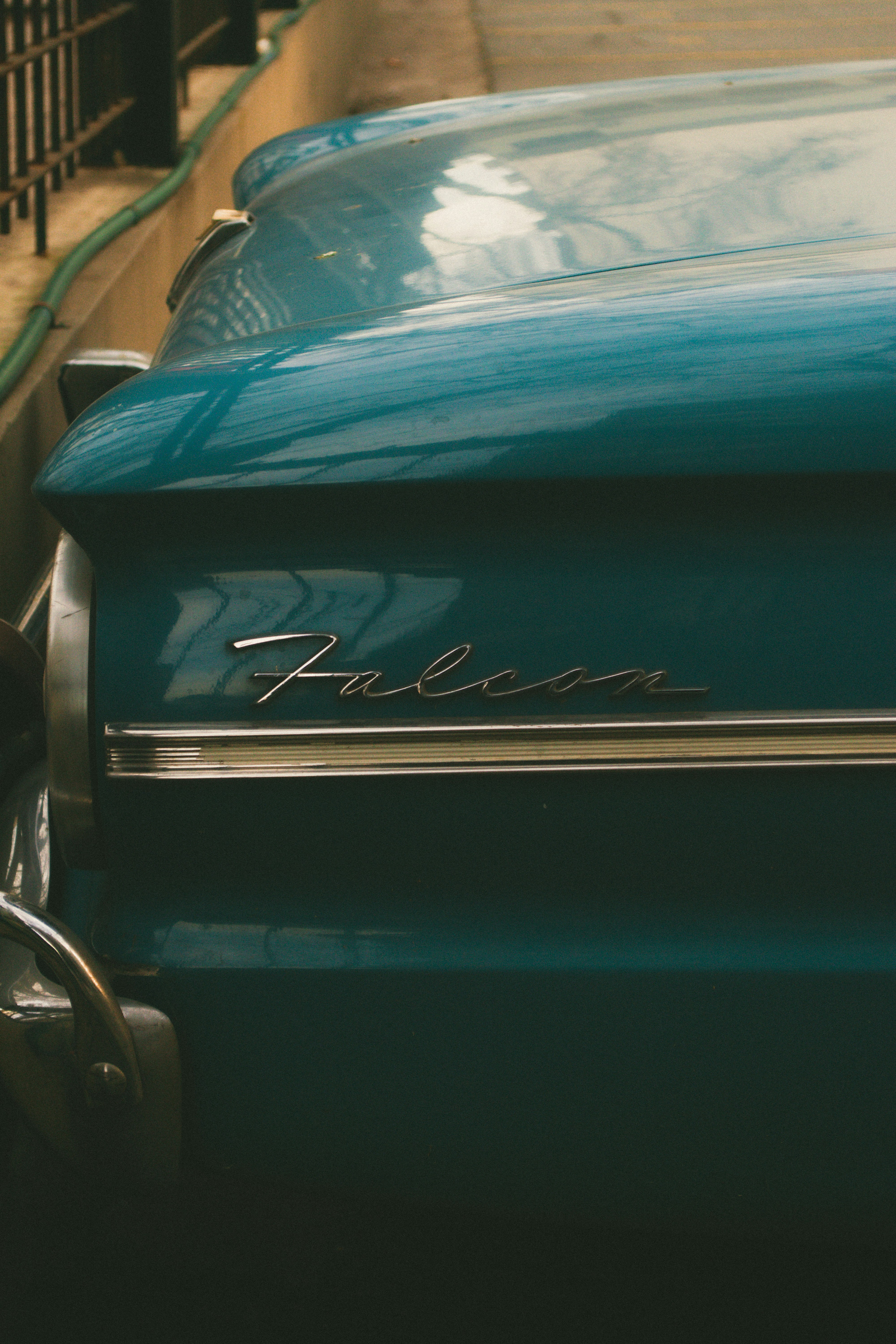 Sunlit Turquoise Falcon Hood: Chrome Script on a Quiet Classic
