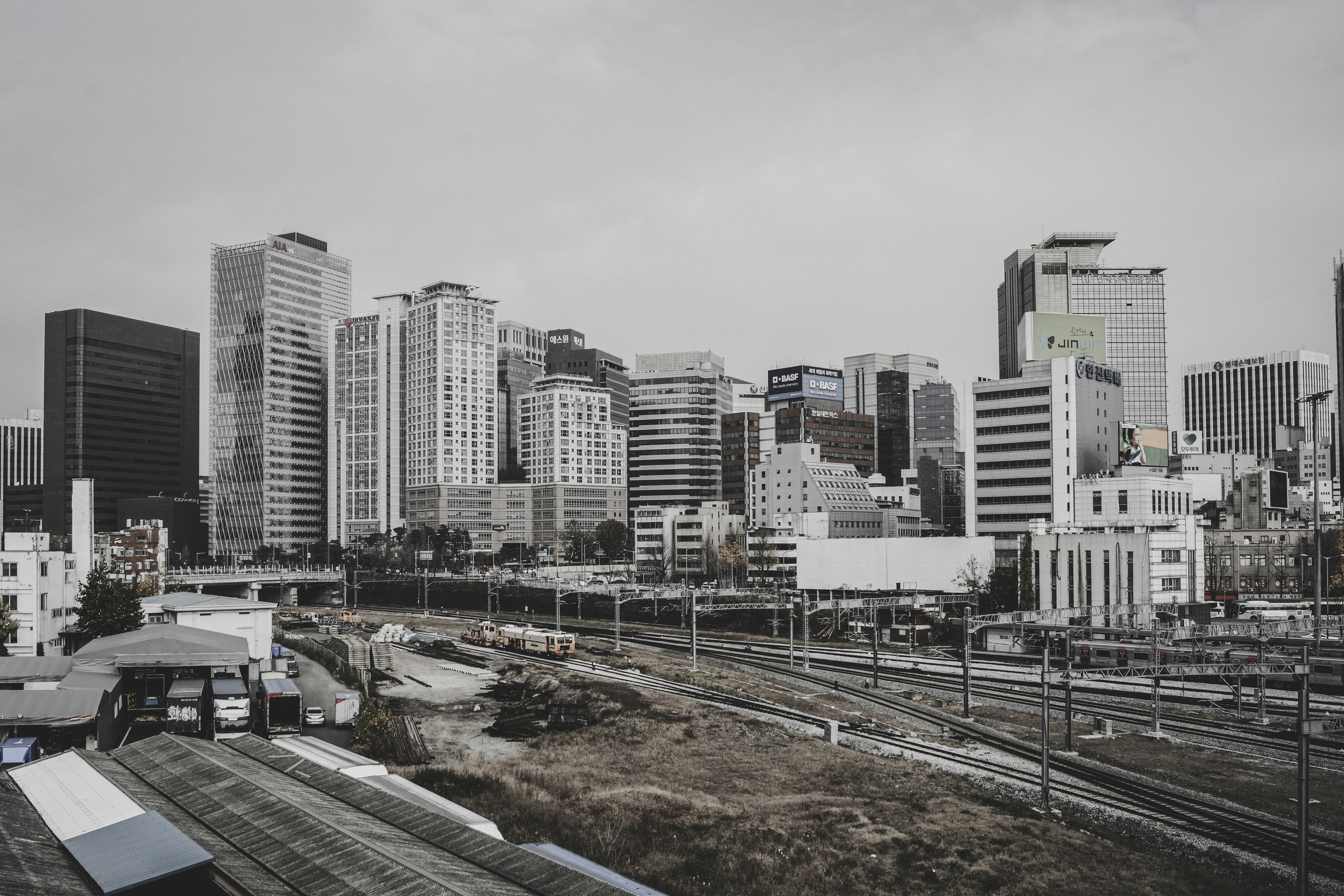 Industrial Rails Meet City Skyline in Monochrome