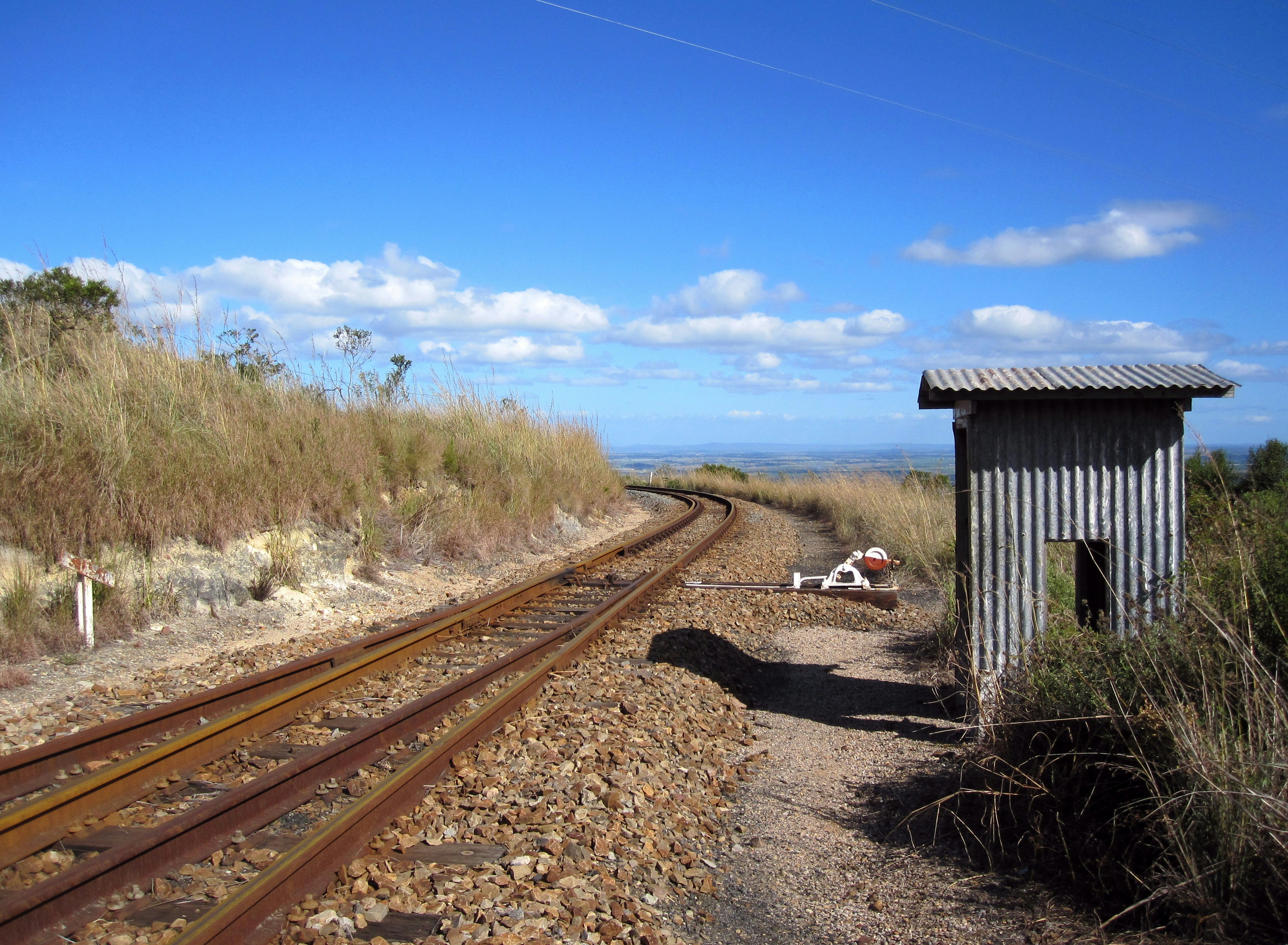 Brown wooden train rail under blue sky during daytime photo – Free ...