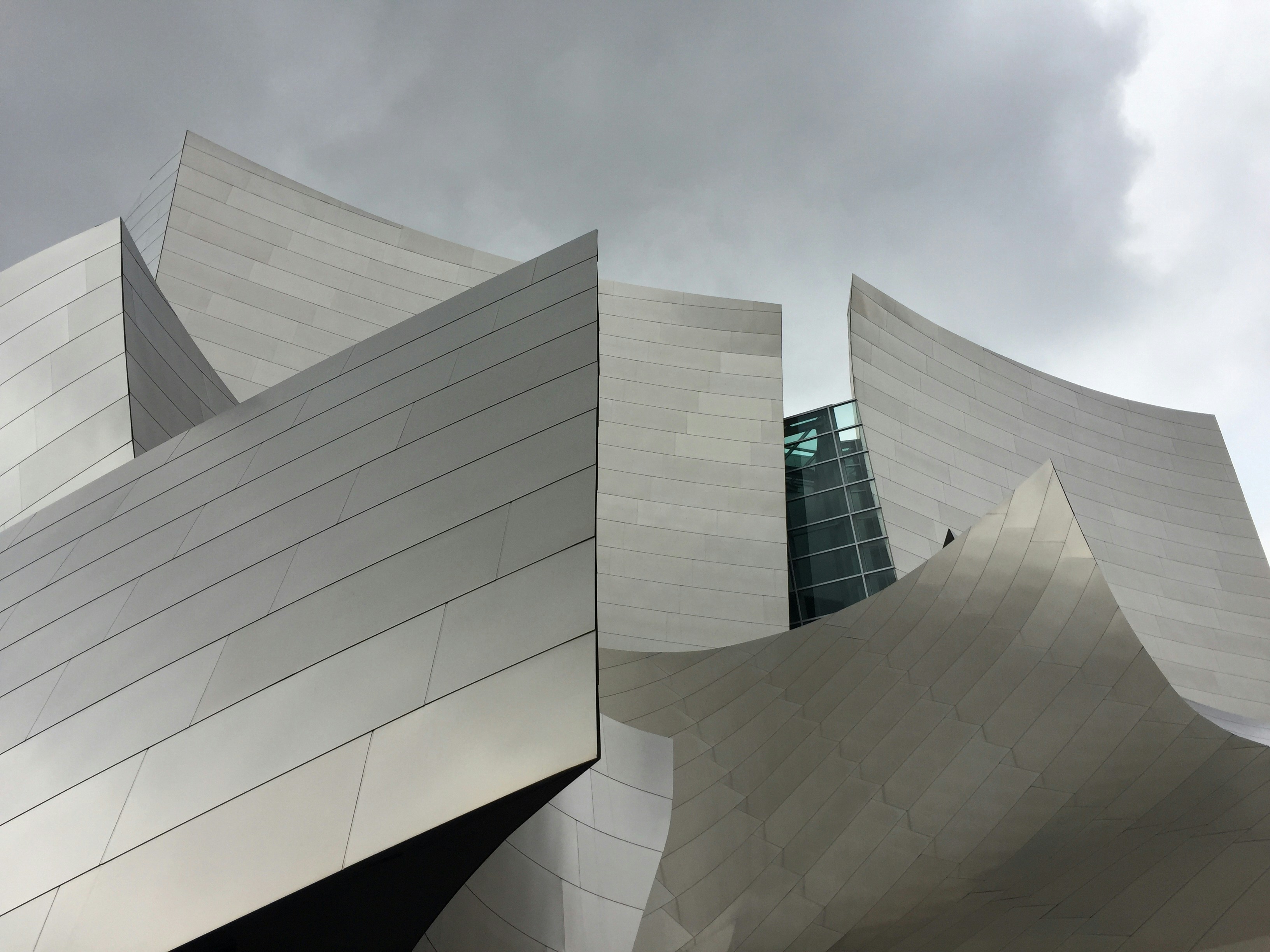 Chrome Waves: Angular Light on a Silvery Facade