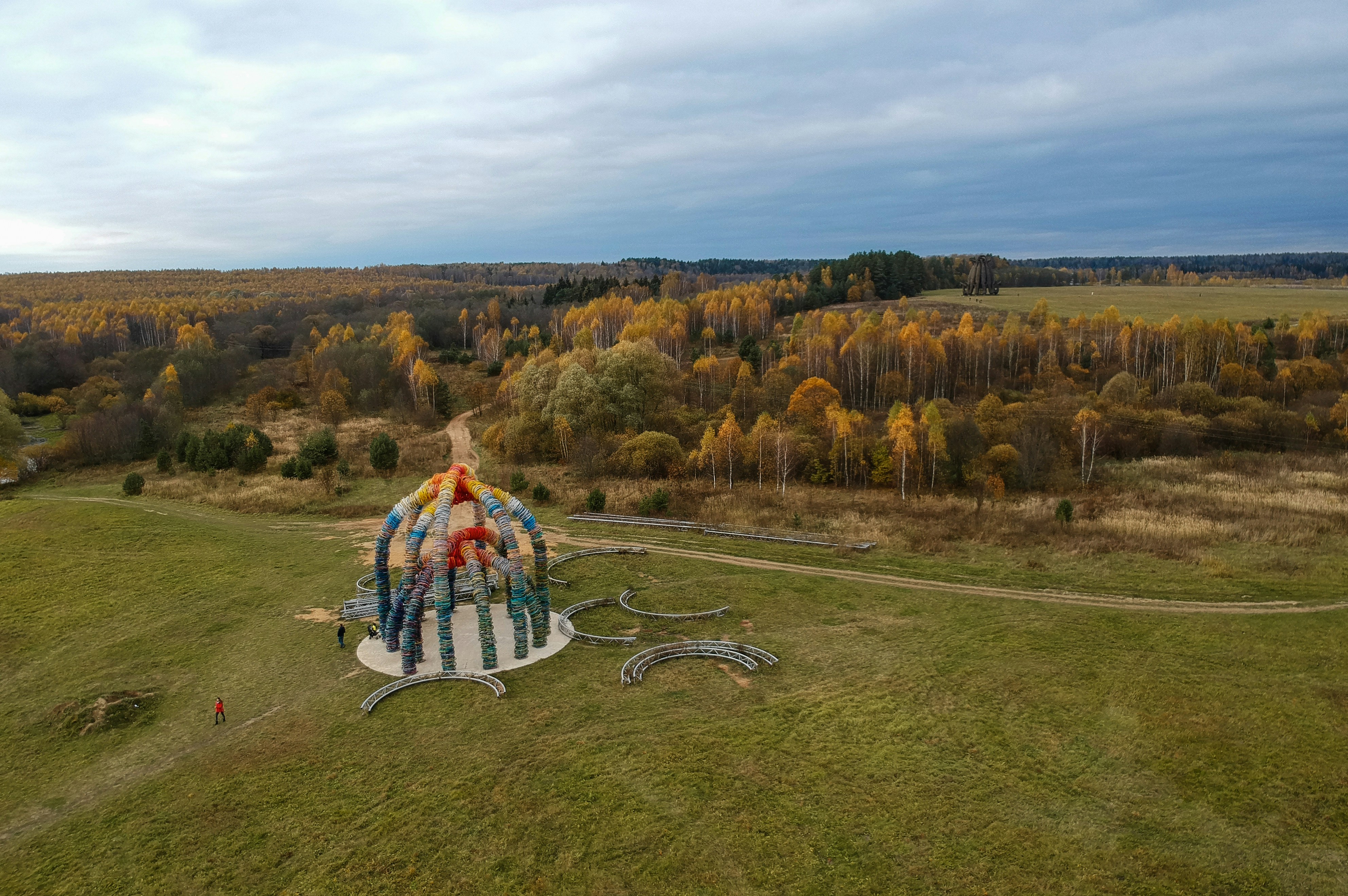 Fiery Core Within a Ring of Blue Arches in an Autumn Field