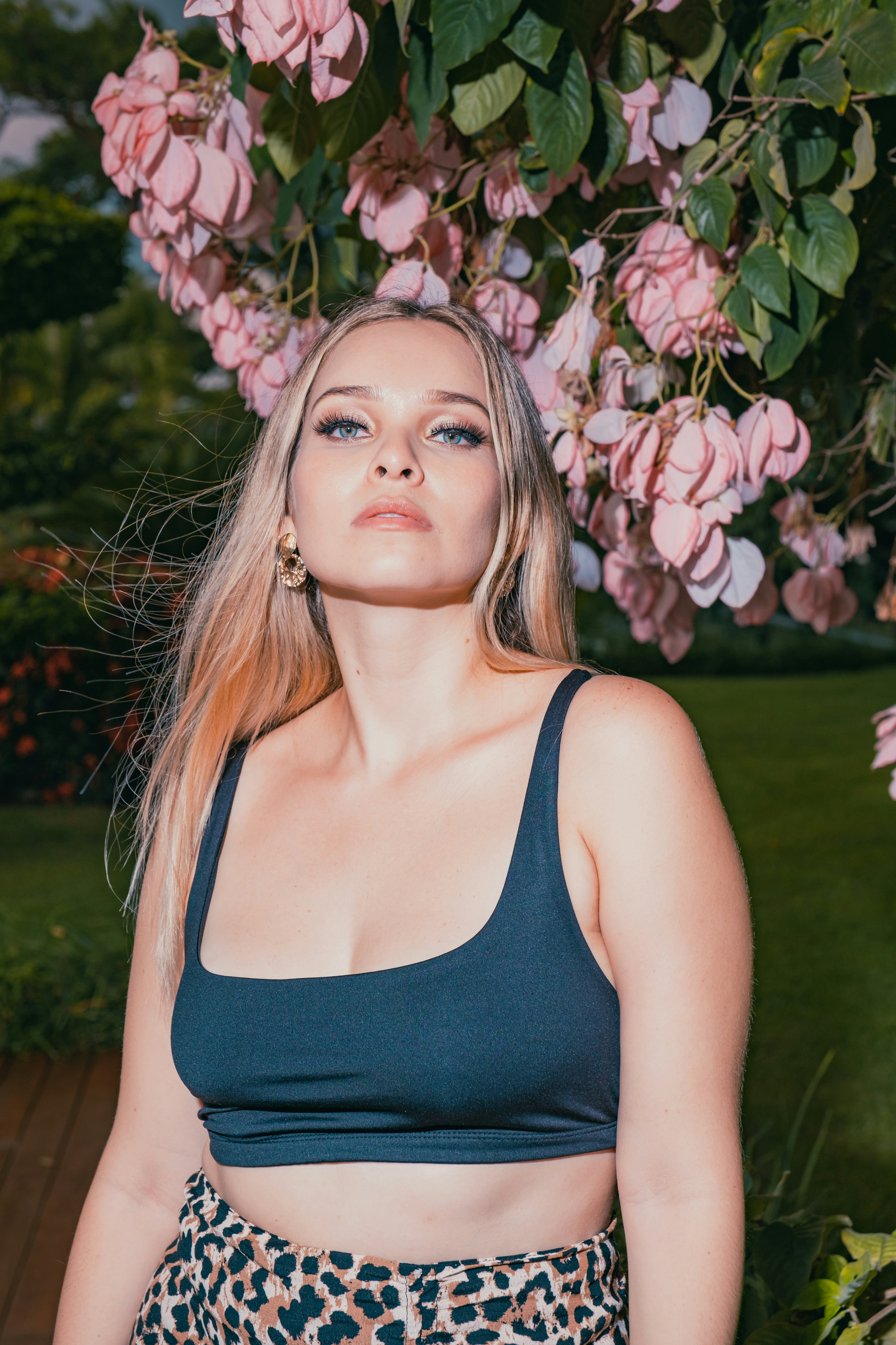 Portrait Beneath Blushing Hydrangeas: Garden Confidence in Blue